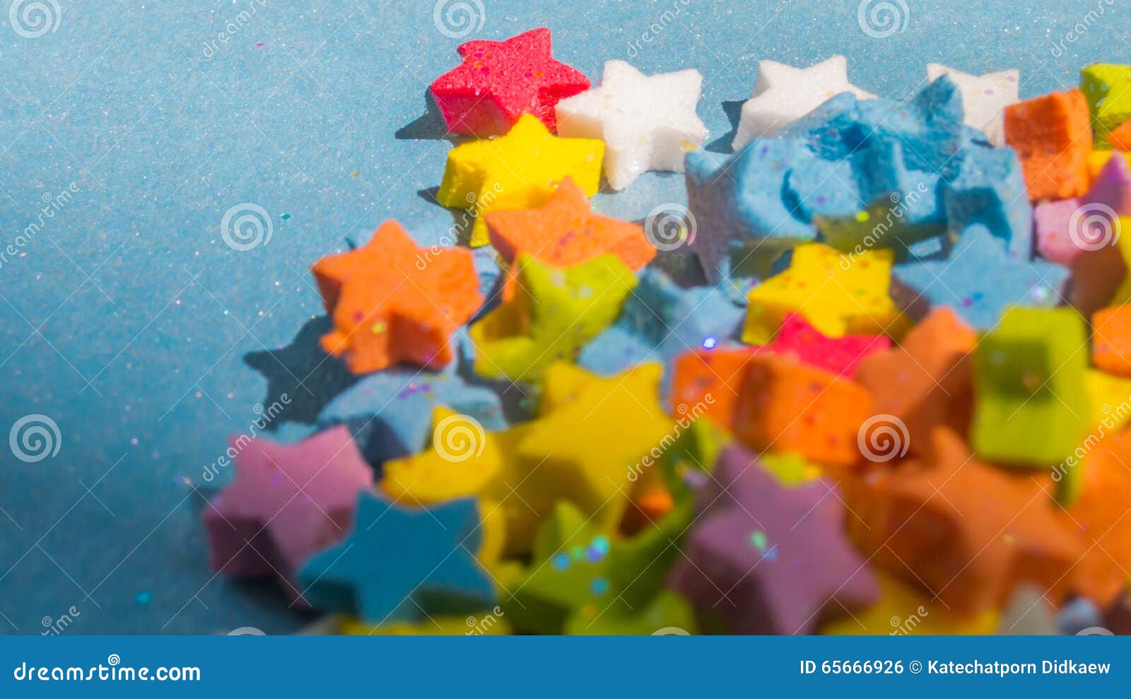 Close-up of Multicolored Star Shapes on Blue Paper Stock Photo - Image ...