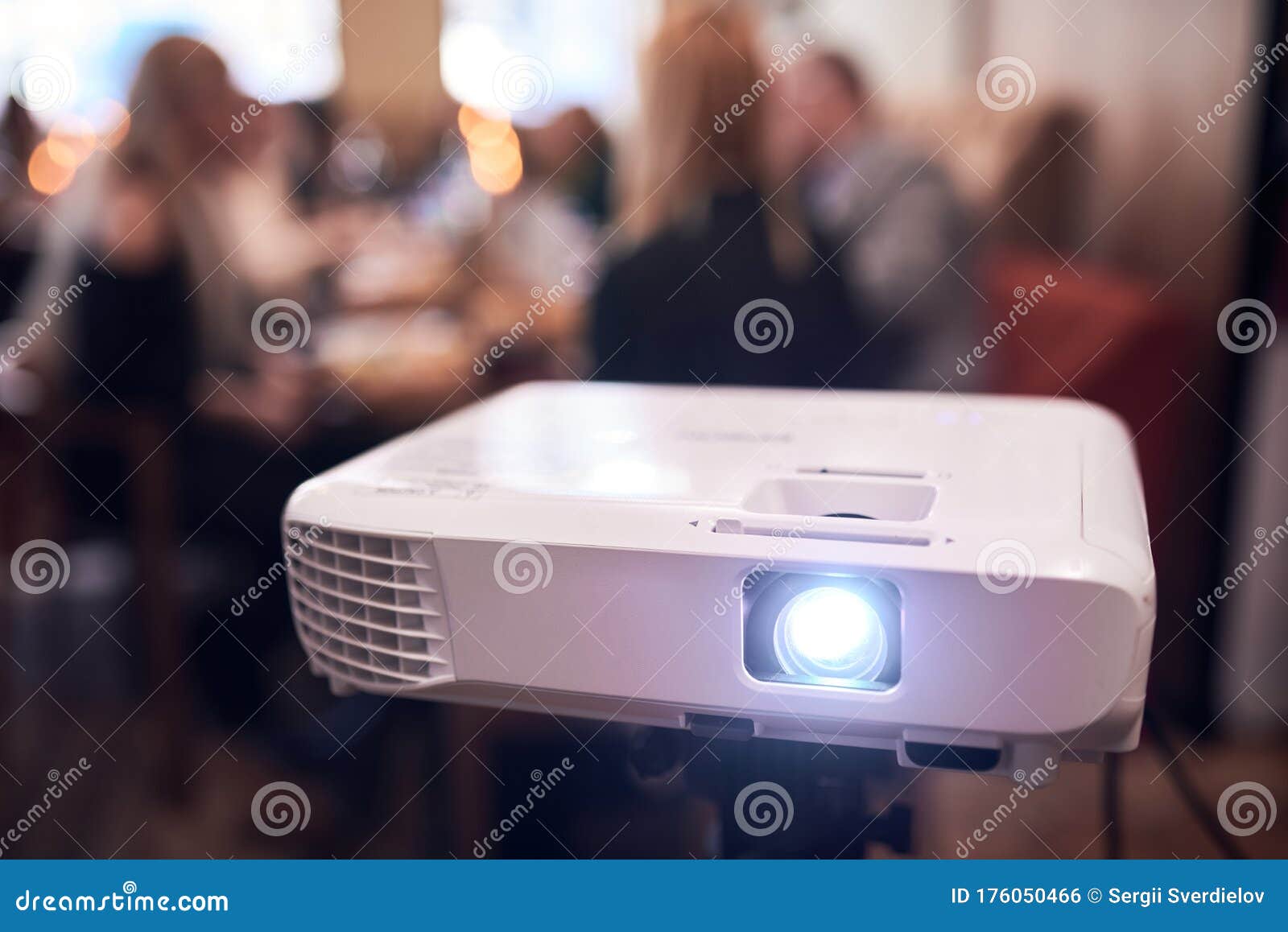 Close-up Multimedia Projector with Blurred People Background Stock ...