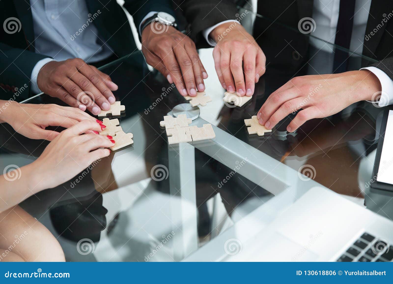 Close Up .multinational Business Team Assembling Puzzle. Stock Photo ... Close Up .multinational Business Team Assembling Puzzle. Stock Photo ...