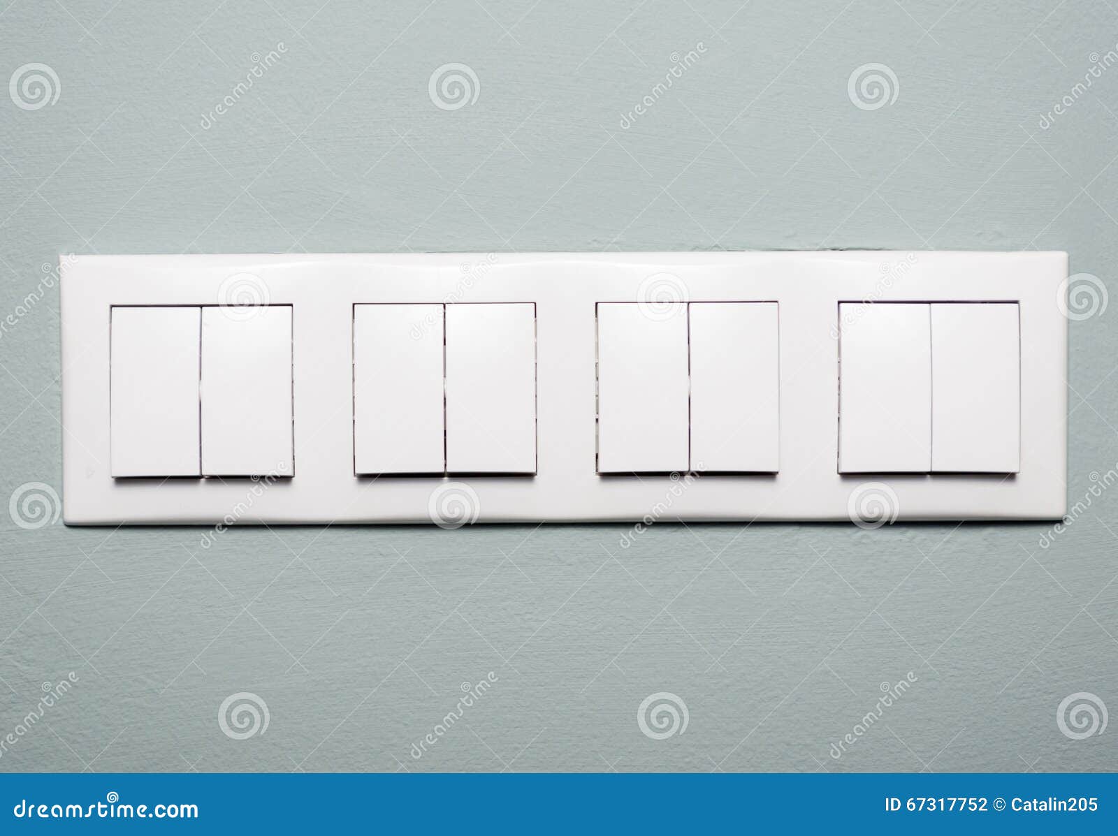 Close-up of Multiple Light Switches on Blue Background Stock Photo ...