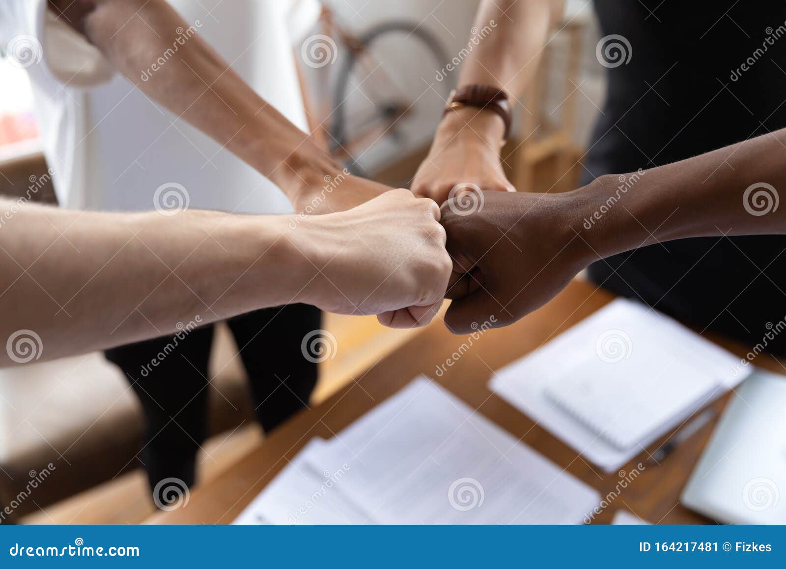 Close Up Multiracial Colleagues Bumping Fists at Meeting Stock Image ... Close Up Multiracial Colleagues Bumping Fists at Meeting Stock Image ...