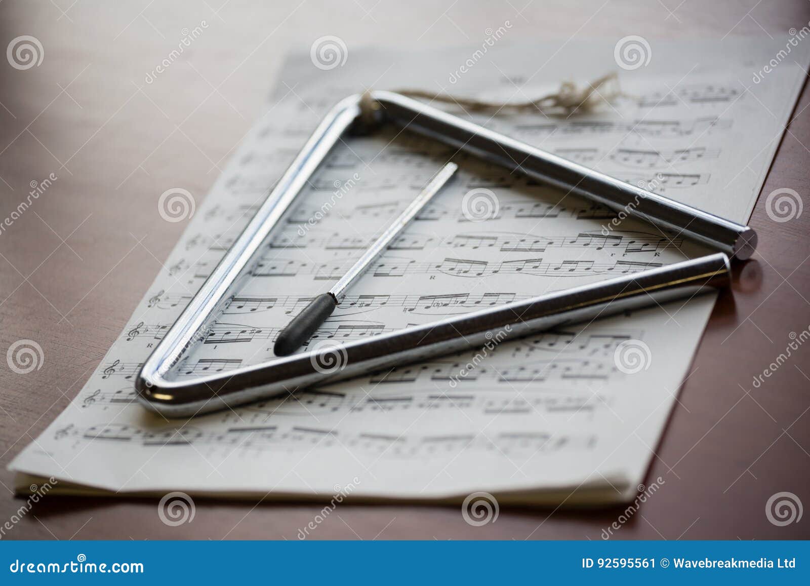 Close Up of Musical Instrument with Sheet Music on Table Stock Image ...