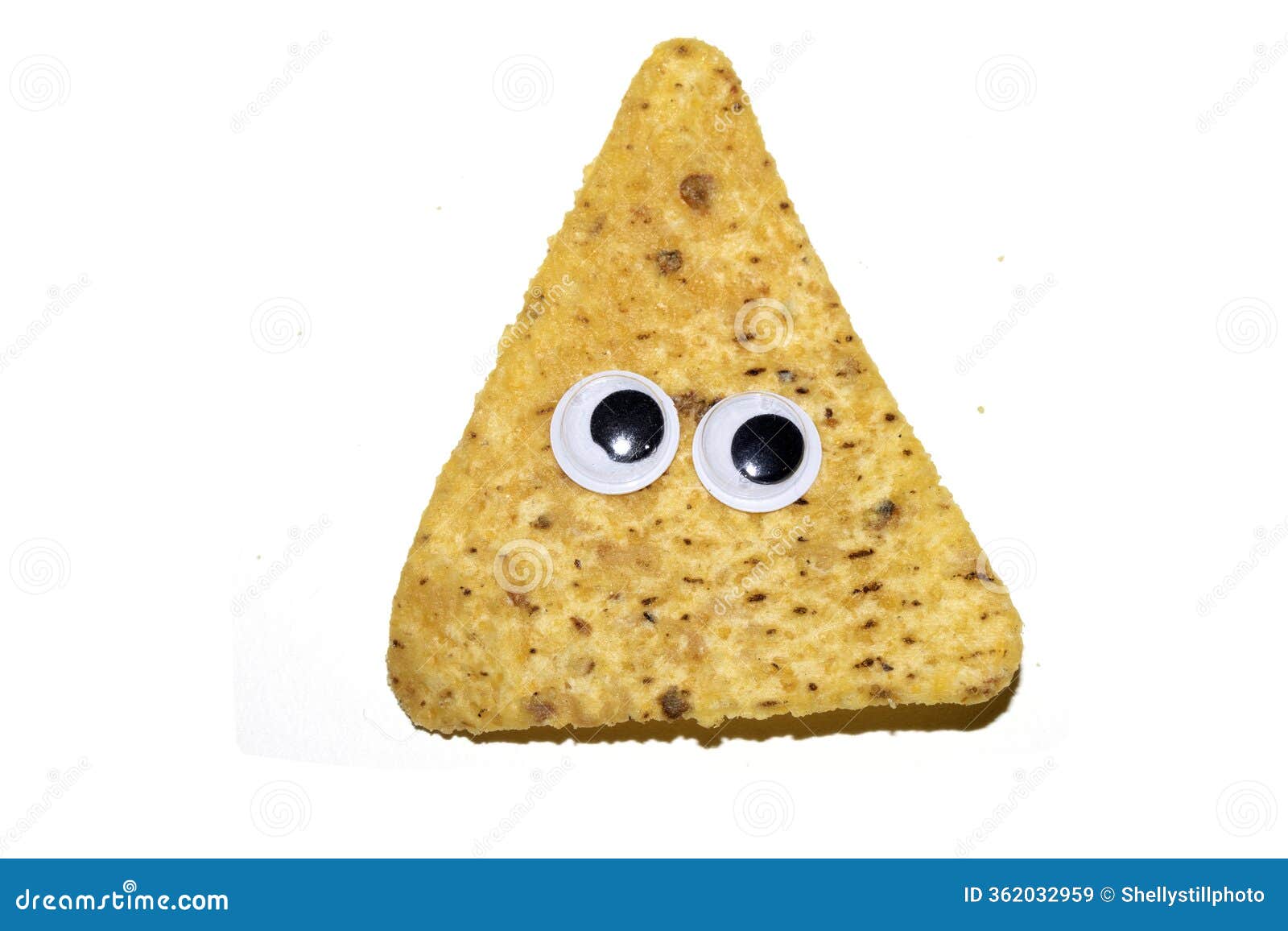 Close Up of Nacho Corn Crisp Chip Triangle Shape Snack with Funny Eyes ...