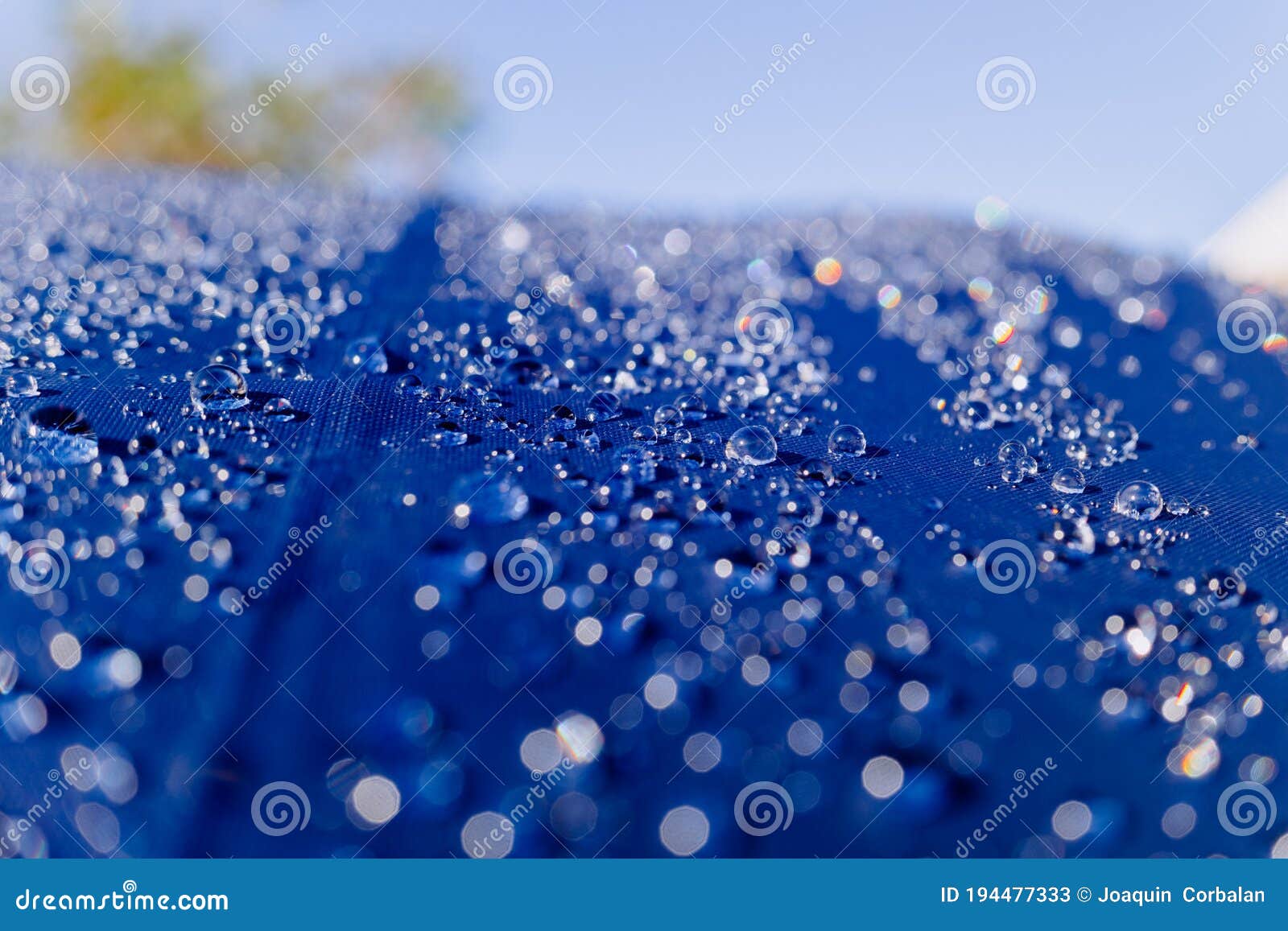 Close-up of Natural and Refreshing Raindrops on the Fabric of a Colored ...