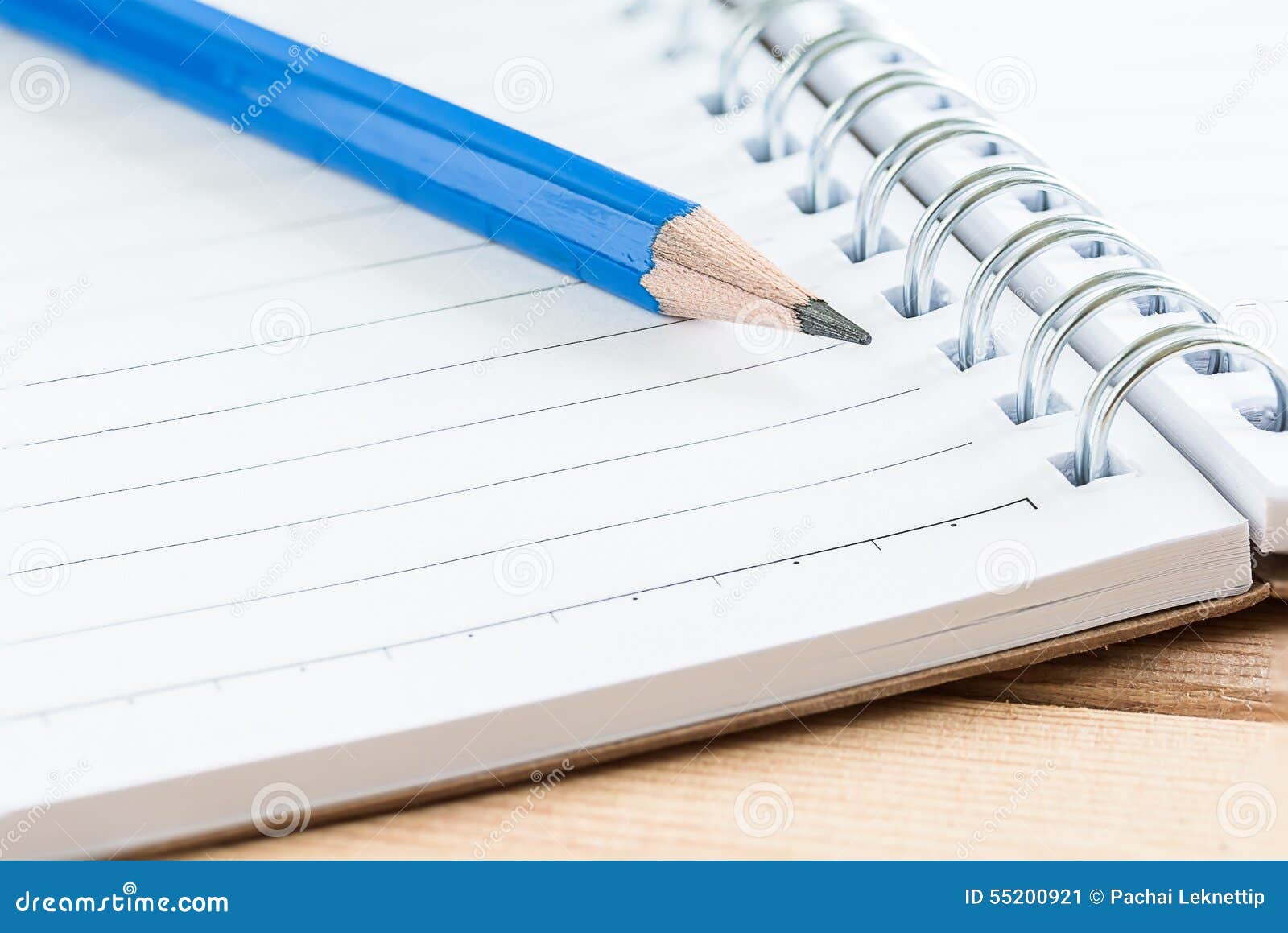 Close-up Notebook and Blue Pencil on Wood Table Stock Image - Image of ...
