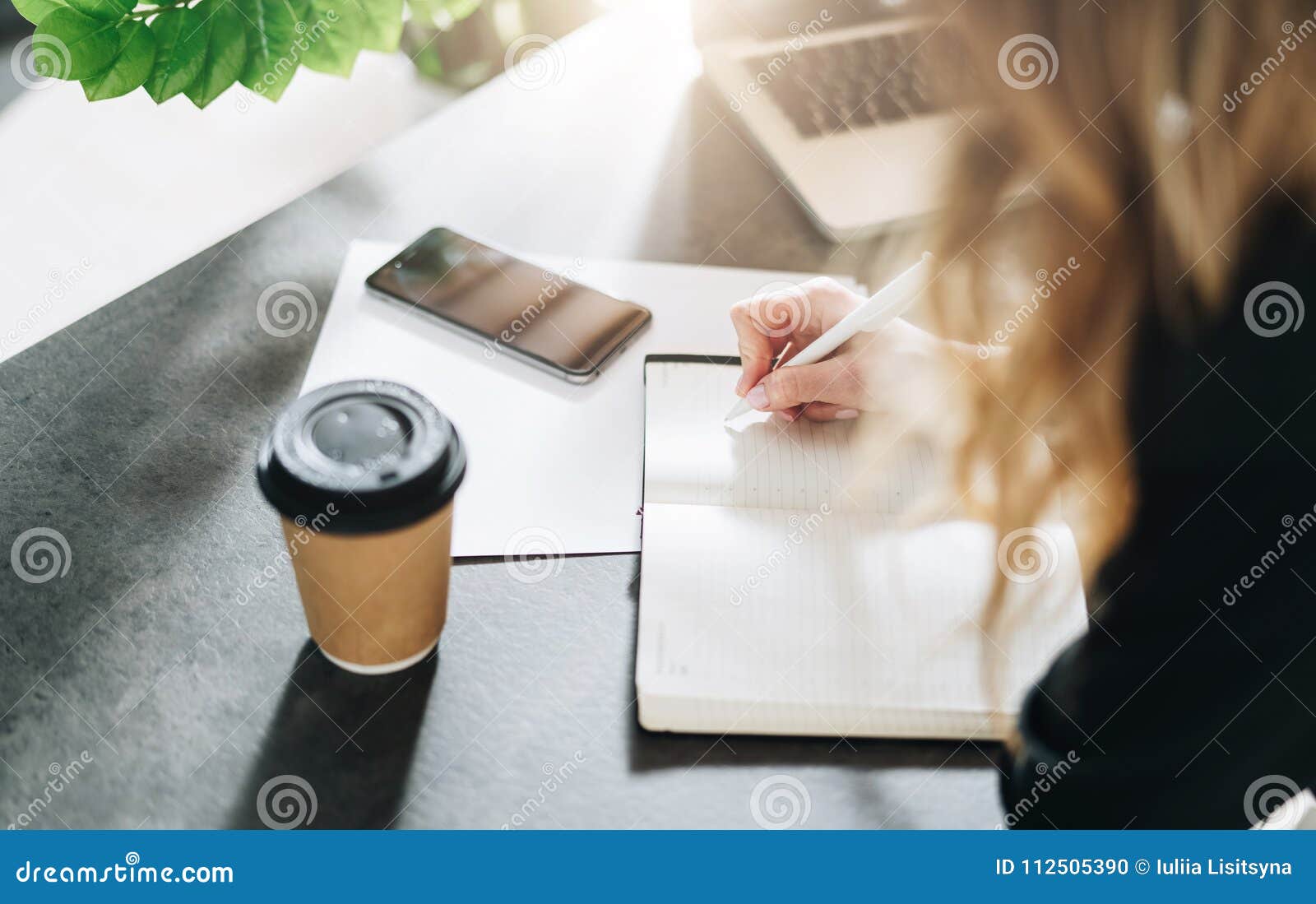 Close-up Notebook on Table, Pen in Female Hand. Girl is Making a Note ...