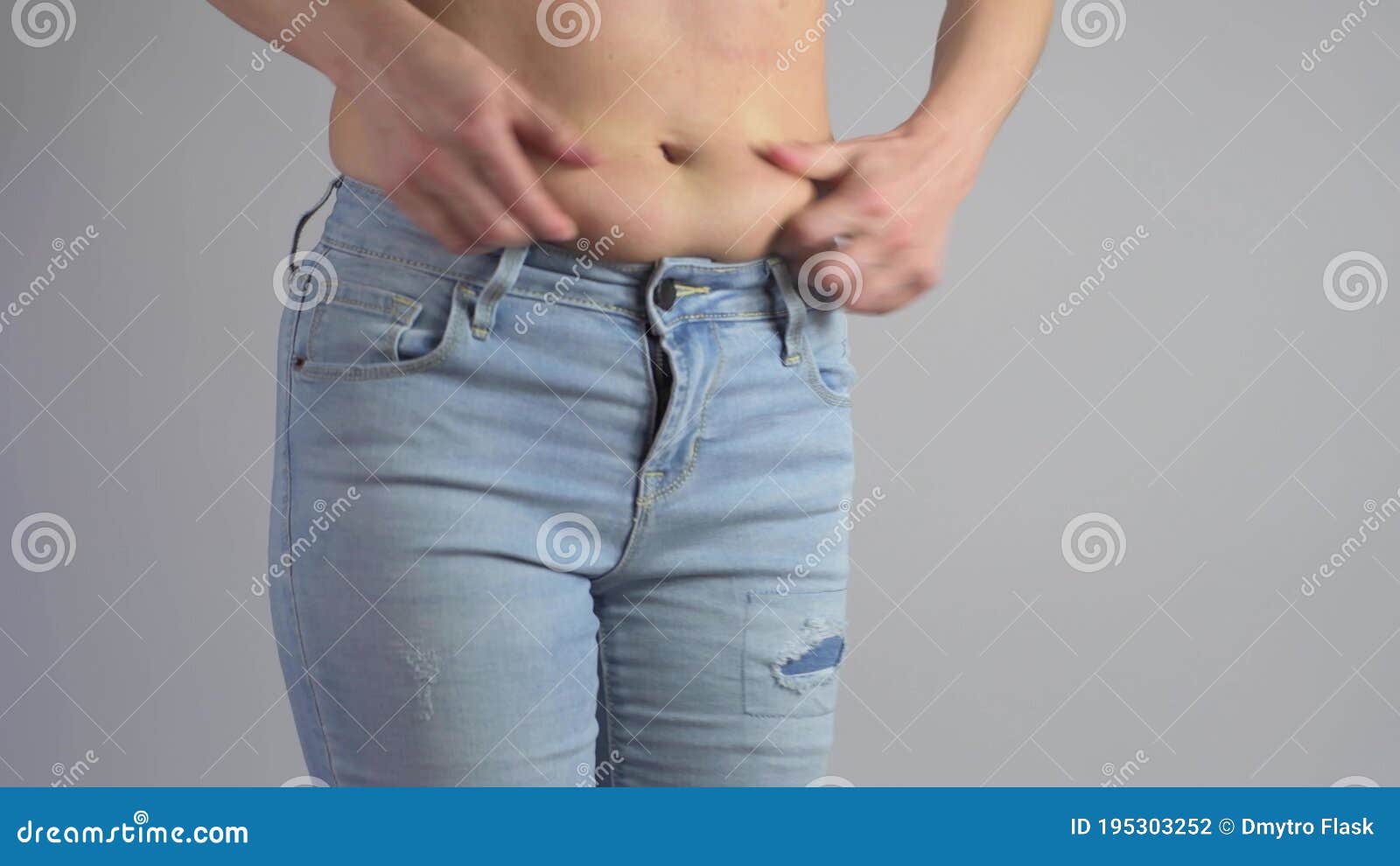 Woman In Jeans Holds Her Belly Fat Woman Overweight Pinch A Fat On Her