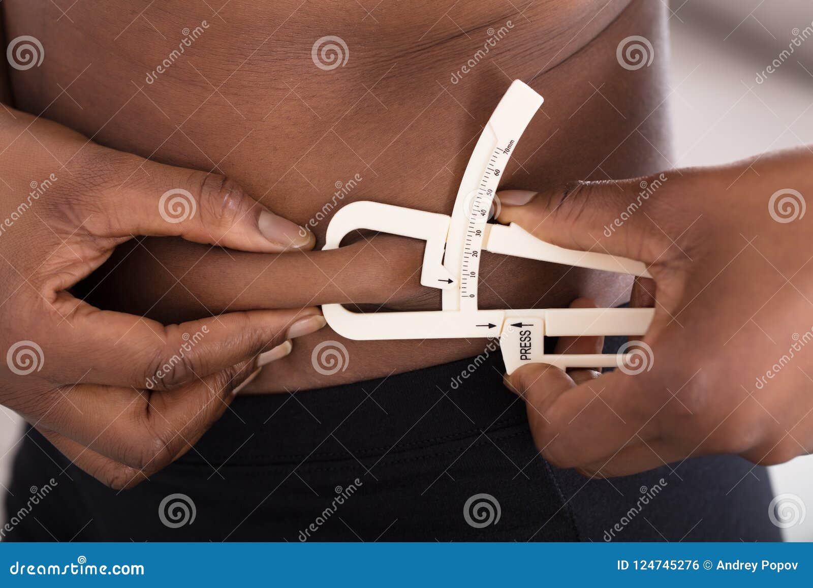 Human Hand Measuring Stomach Fat with Caliper Stock Photo - Image of ...