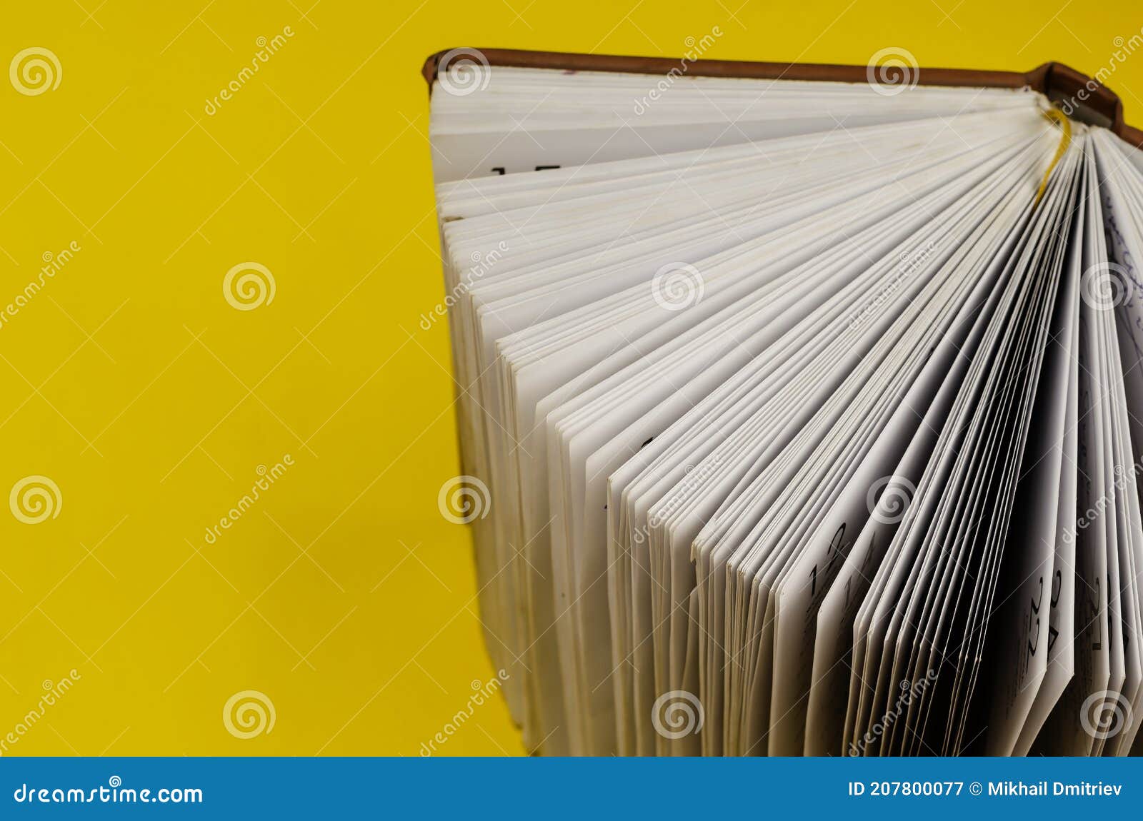 Close-up of an Old Diary Standing on the Endpaper Against a Yellow ...