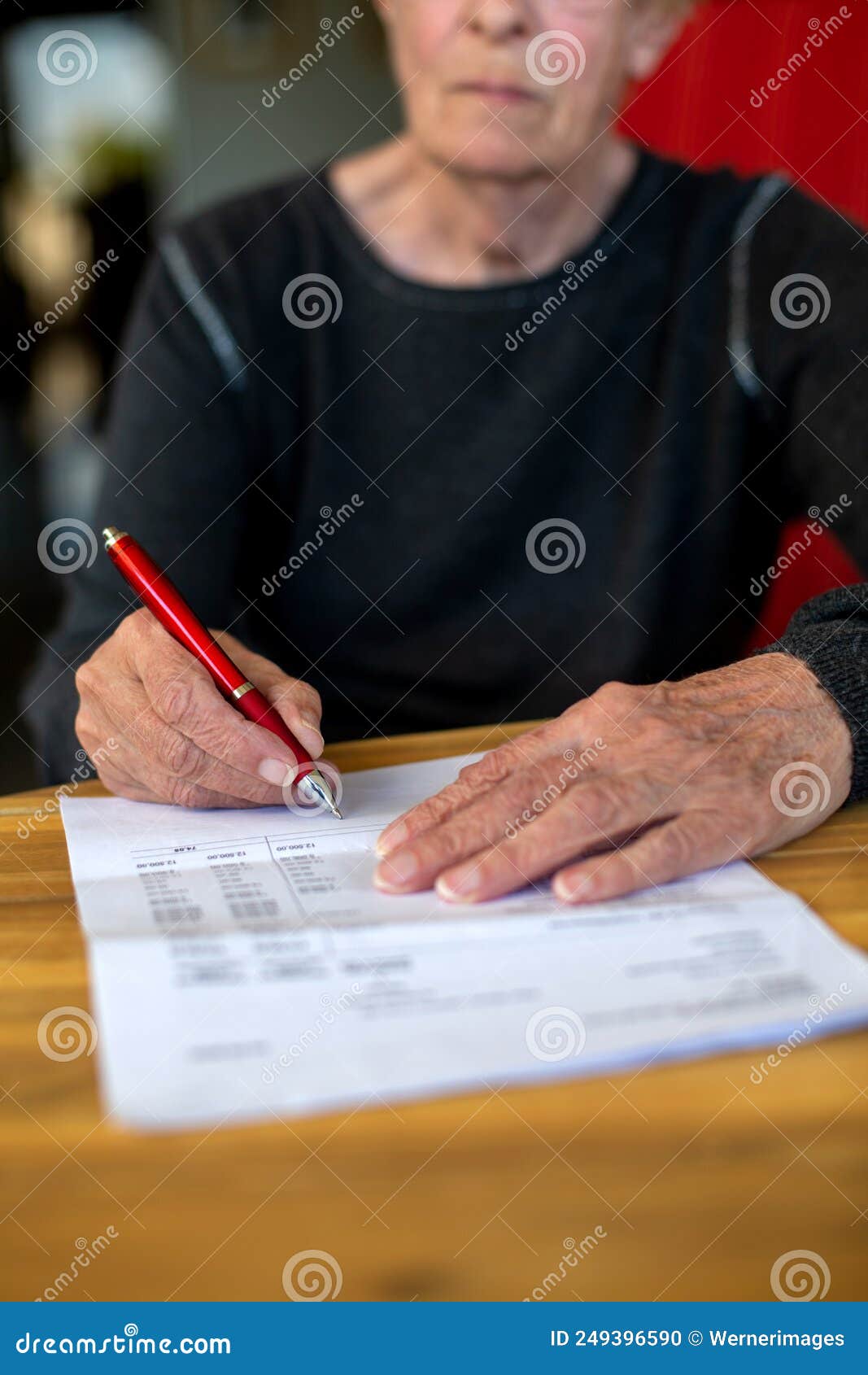 Close-up of Older Womans Hand Signing a Paper Stock Photo - Image of ...