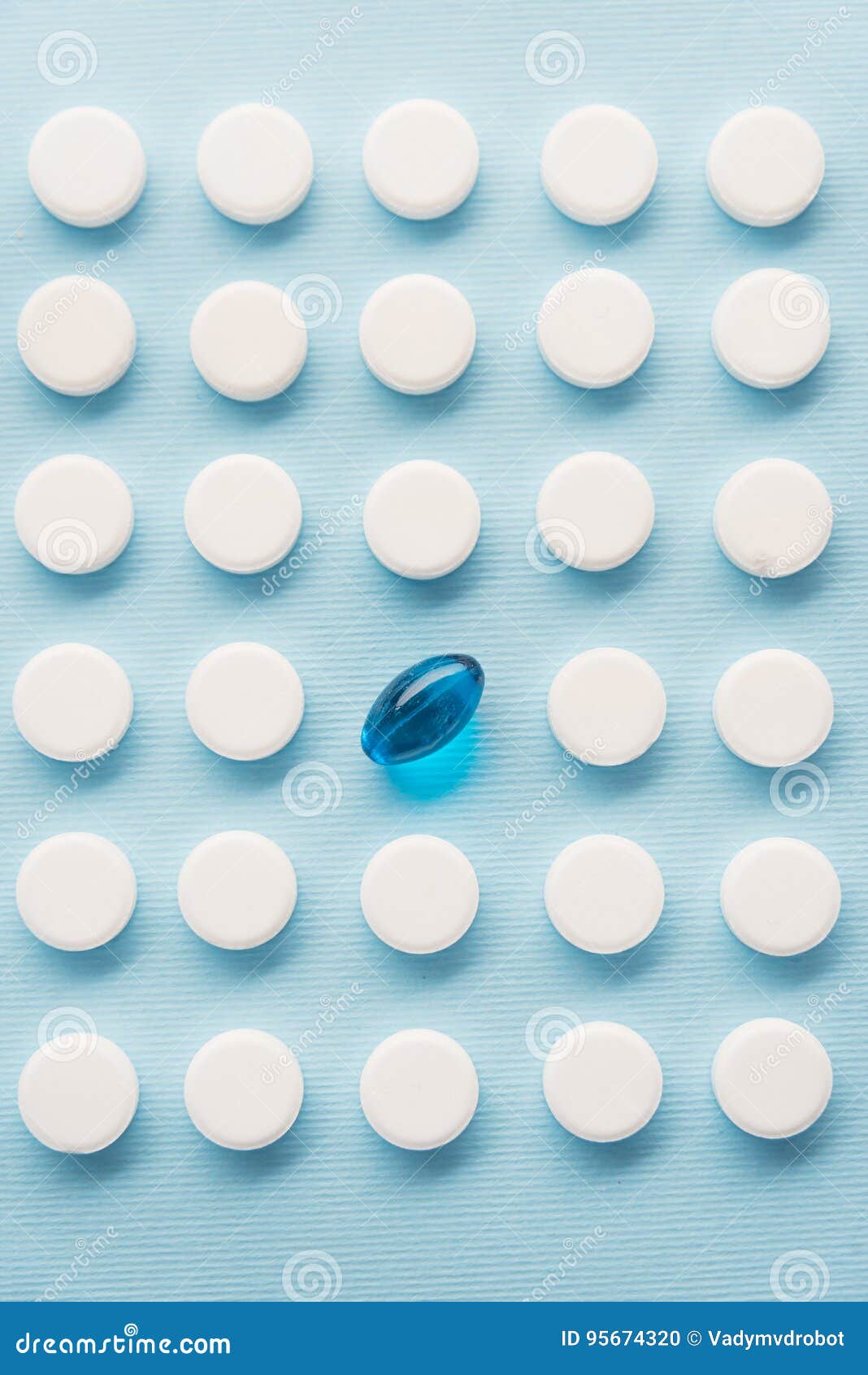 Close Up of One Capsule Surrounded by White Tablets Stock Photo - Image ...