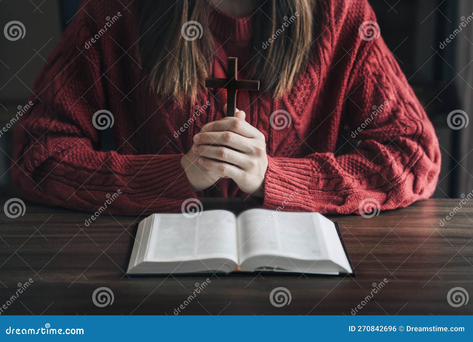 Close Up of an Open Bible with a Cross for Morning Devotion on a Wooden ...
