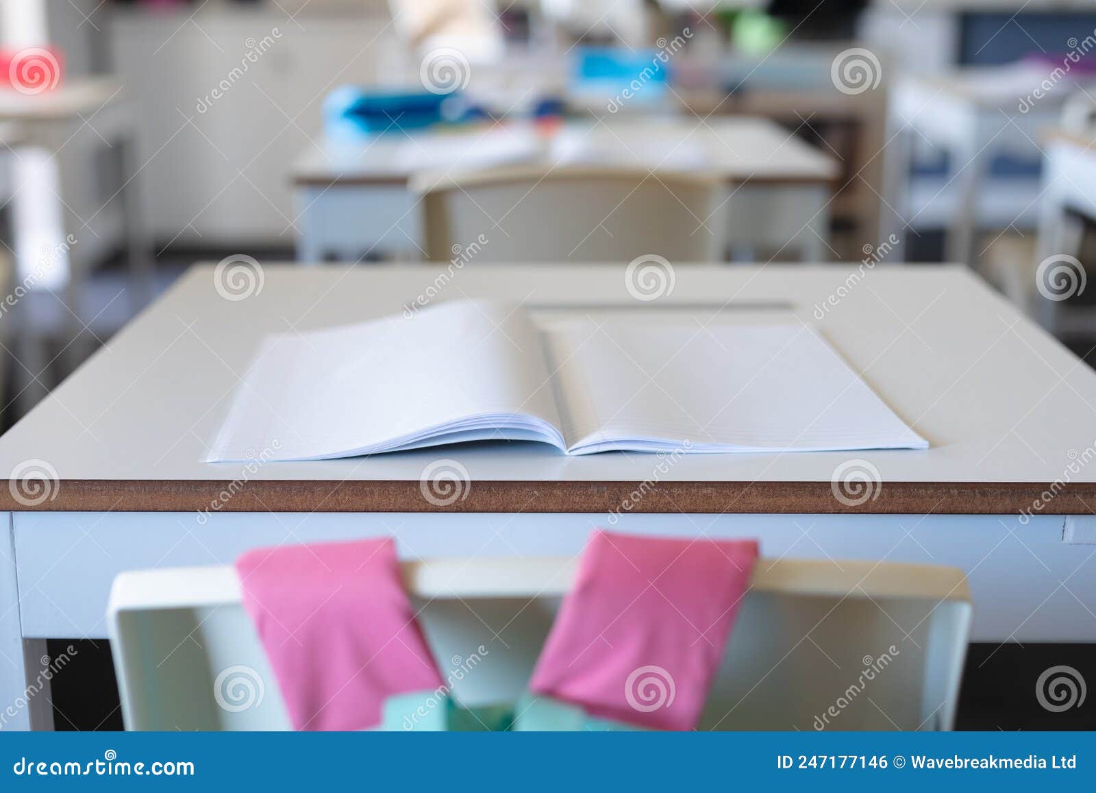 Close-up of Open Book on Desk in Classroom Stock Photo - Image of ...