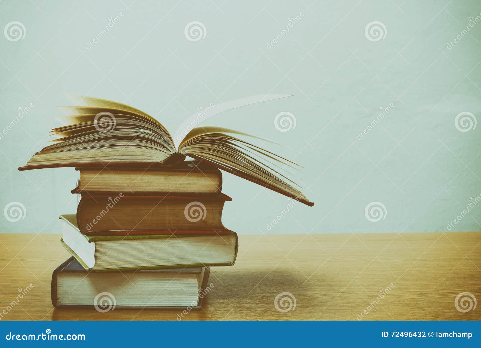 Close Up of Open Book and Stack of Books on Desk with Vintage Filter ...