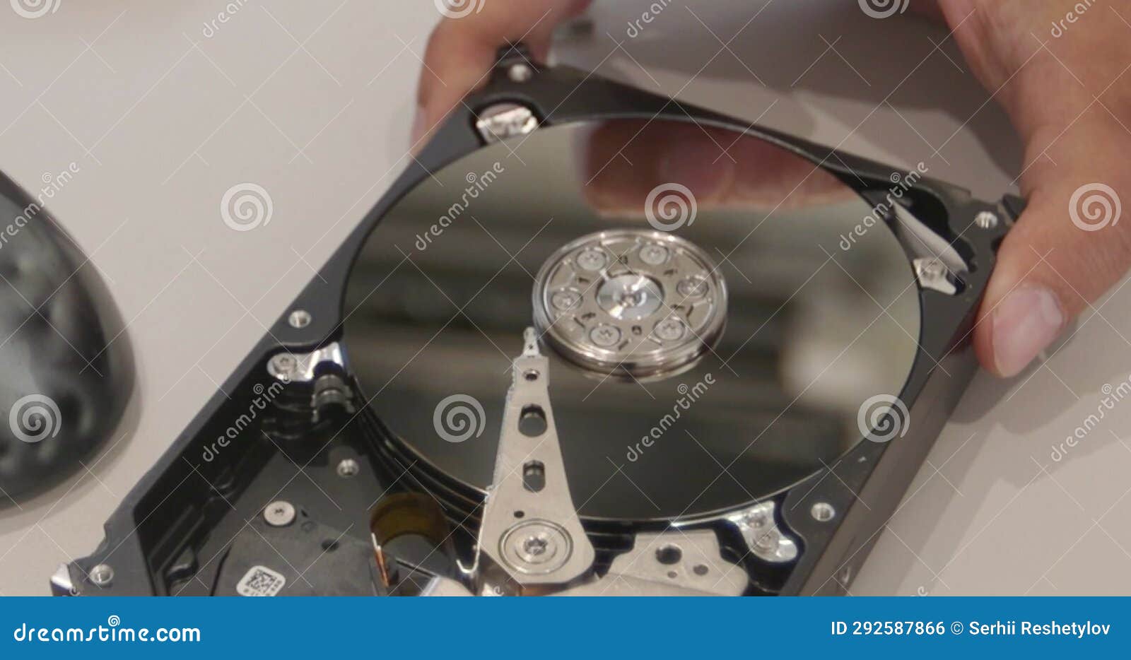 Close-up of an Open Hard Disk Drive in the Hands of a Technician Stock ...