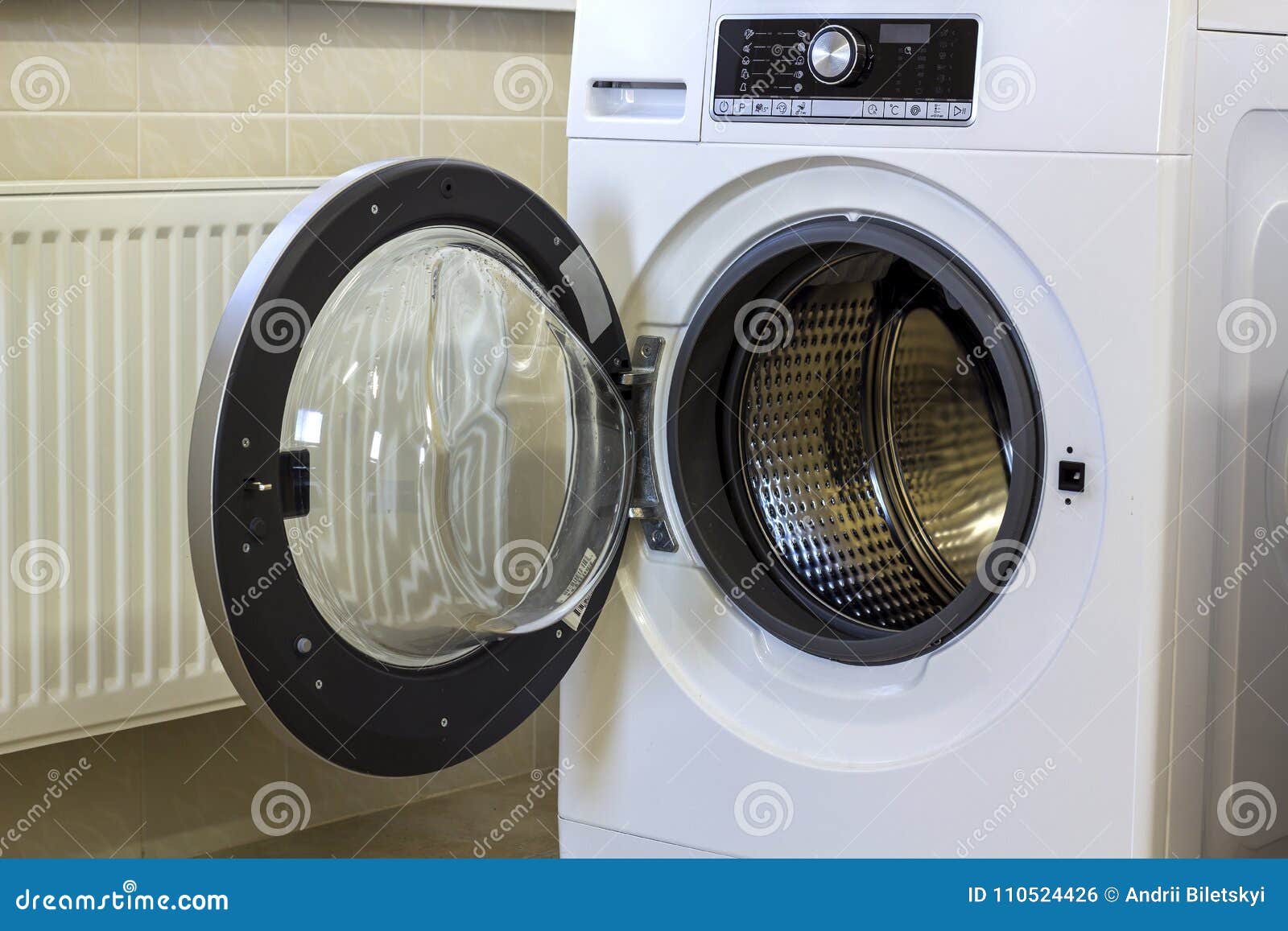 A Close Up of Open Washing Machine in Bathroom Stock Photo - Image of ...