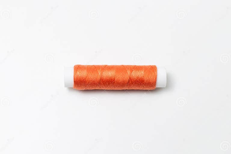Close-up of Orange Thread Spool Isolated on White Background. Stock ...