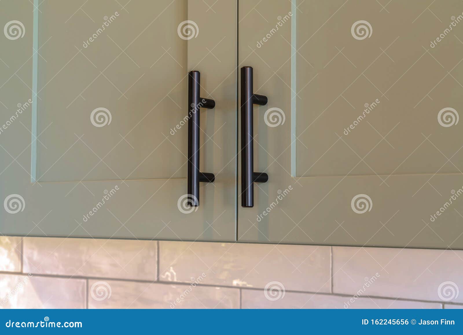 Close Up of Overhead Kitchen Cupboard Handles Stock Photo - Image of ...