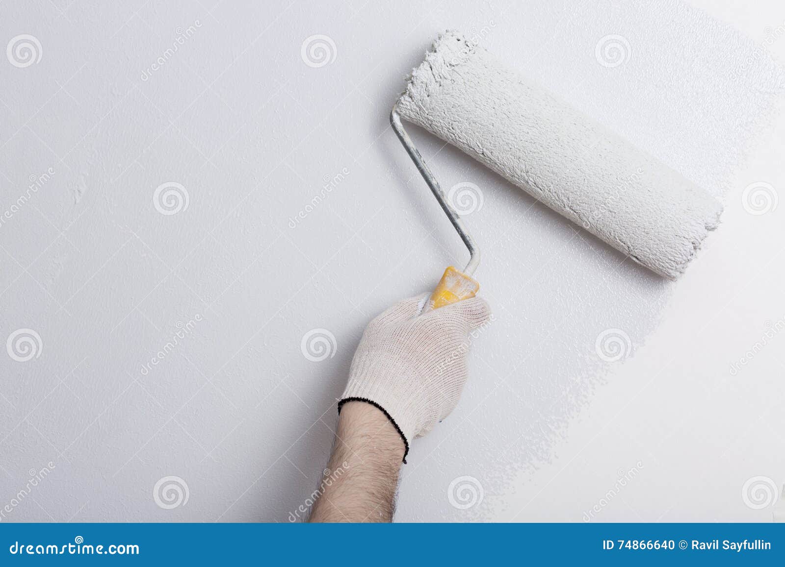 Close Up of Painter Arm Painting a Wall with Paint Roller Stock Photo ...