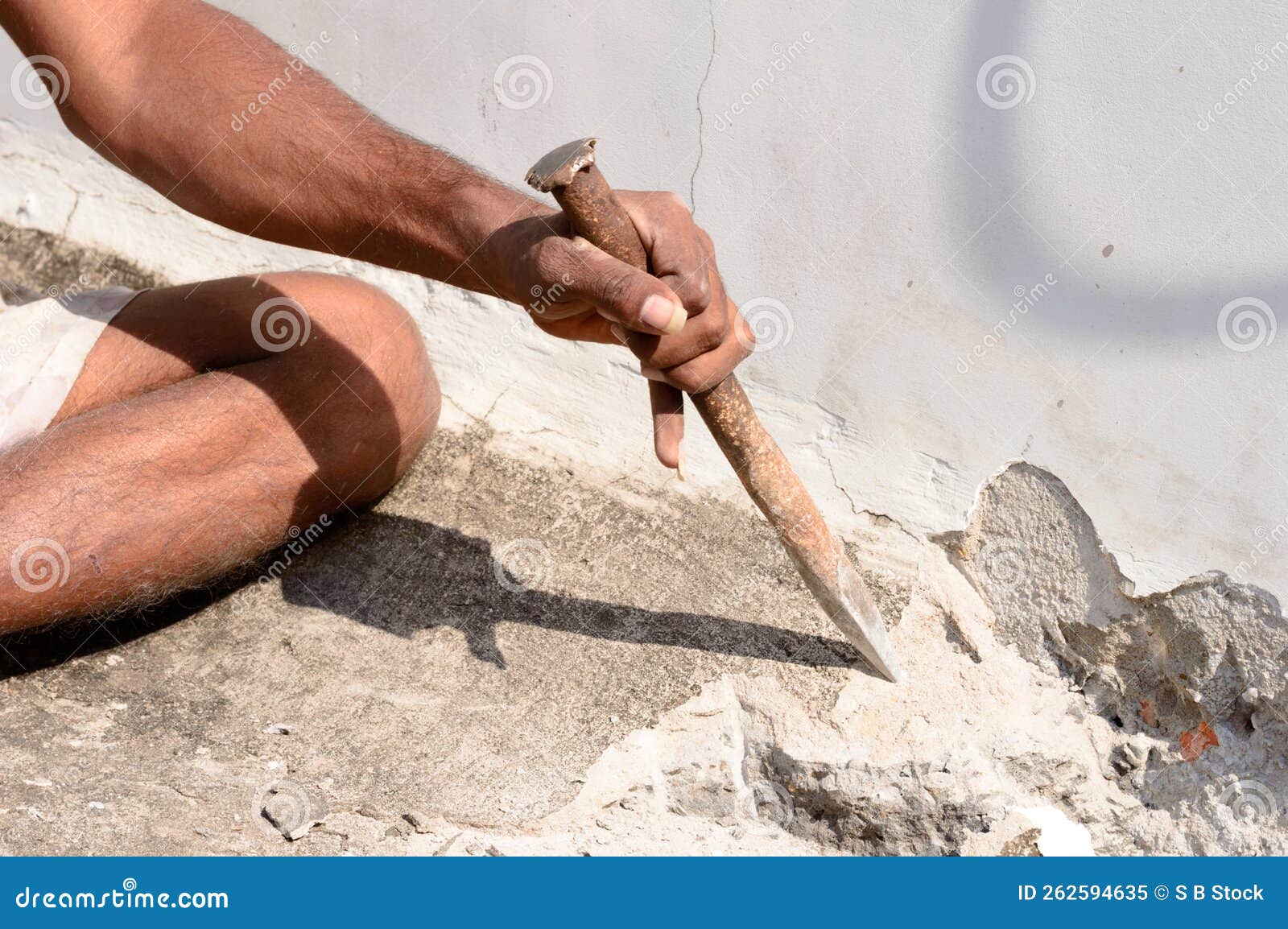 Close Up Part of a Construction Labor Working with Hammer and Chisel in ...