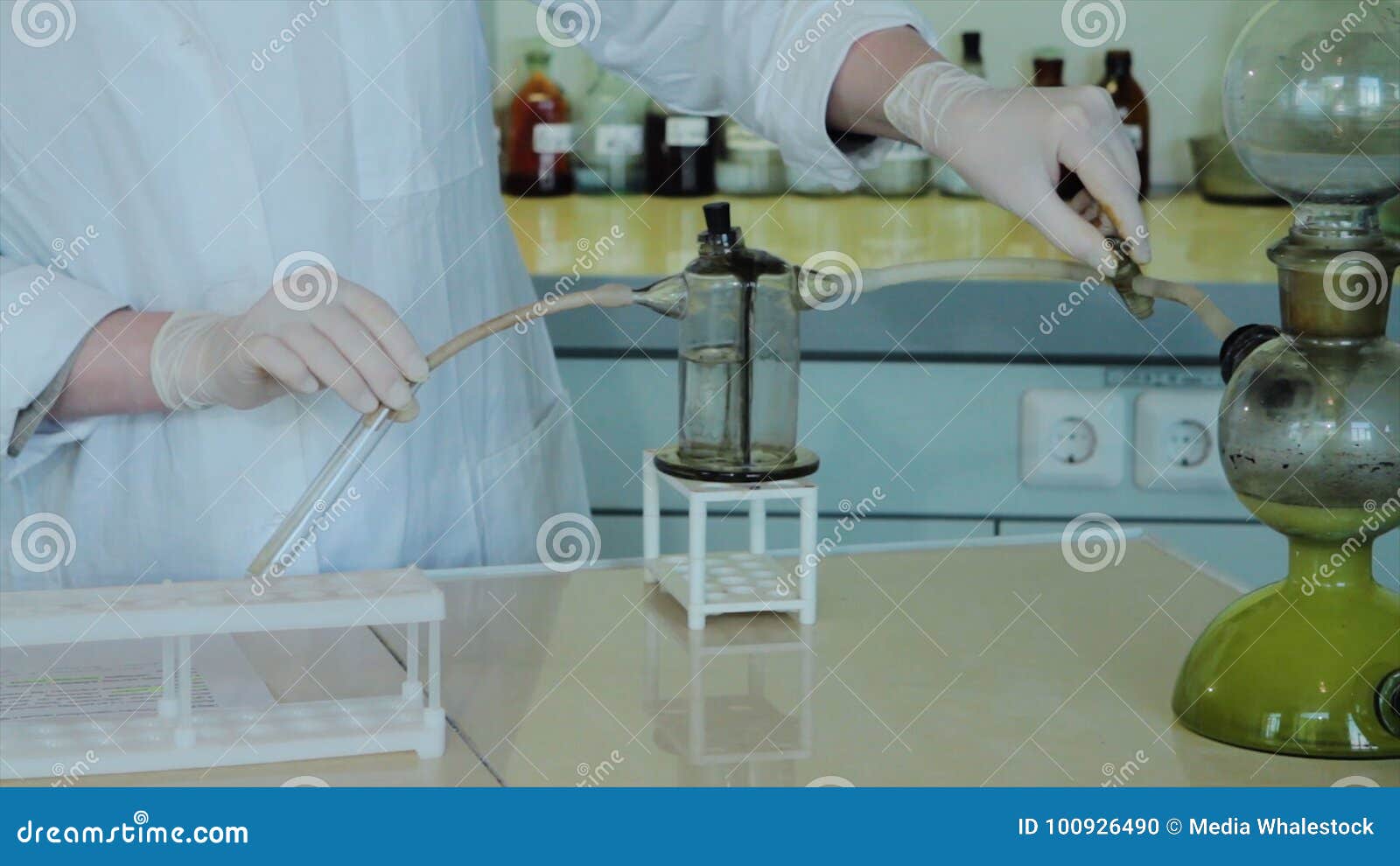 Close-up Partial View of Scientists Making Experiment with Reagent and ...