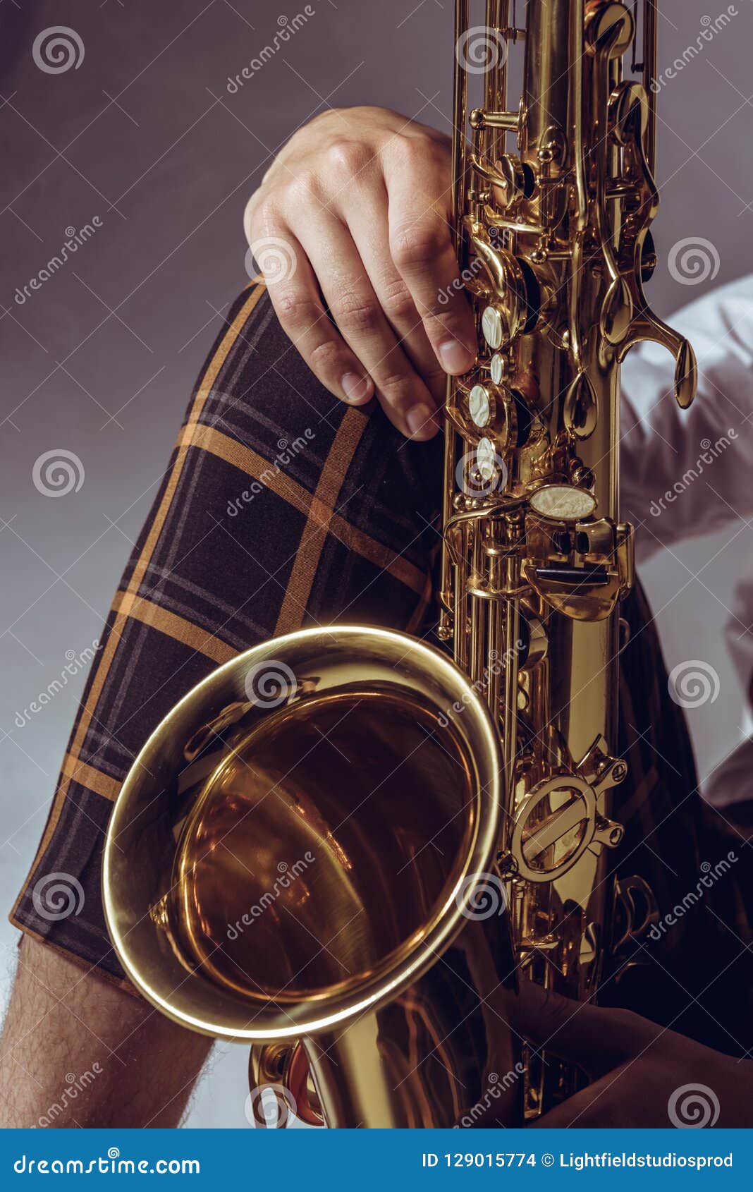 Close-up Partial View of Stylish Professional Musician Holding ... Close-up Partial View of Stylish Professional Musician Holding ...