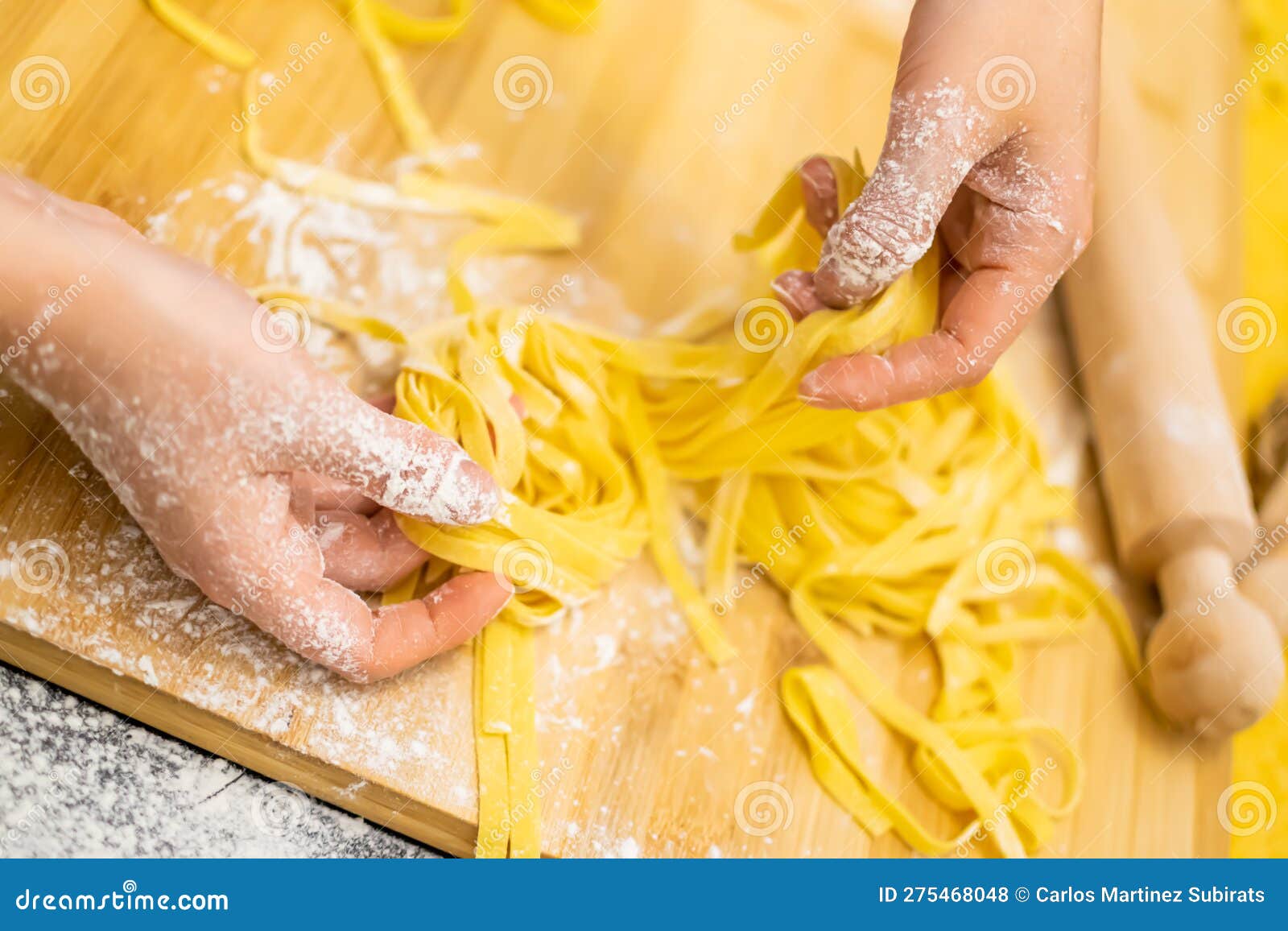 Close Up of Pasta and Hands Making Home Made Italian Pasta Stock Photo ...