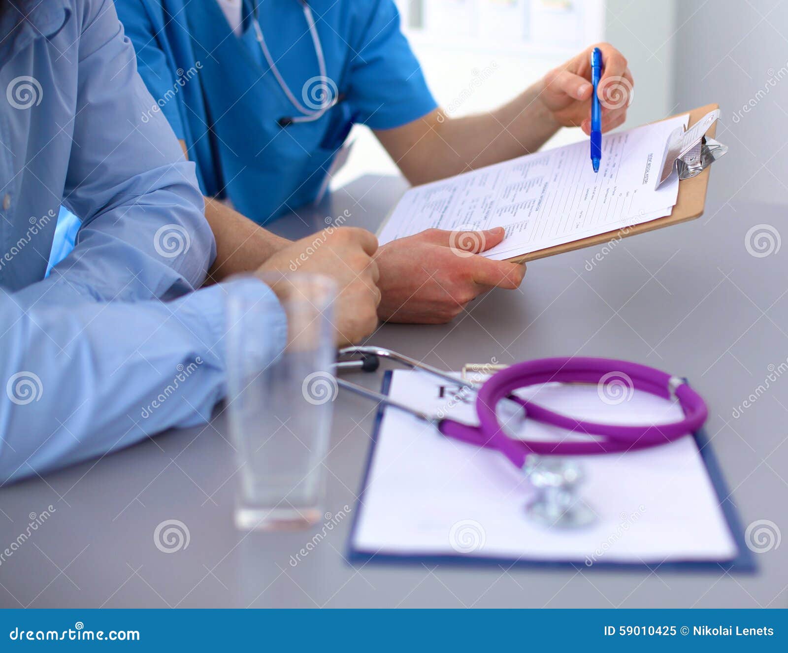 Close Up of Patient and Doctor Taking Notes Stock Image - Image of ...