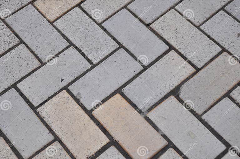 A Close Up of a Paving Herringbone Pattern Background As a Common Paver ...