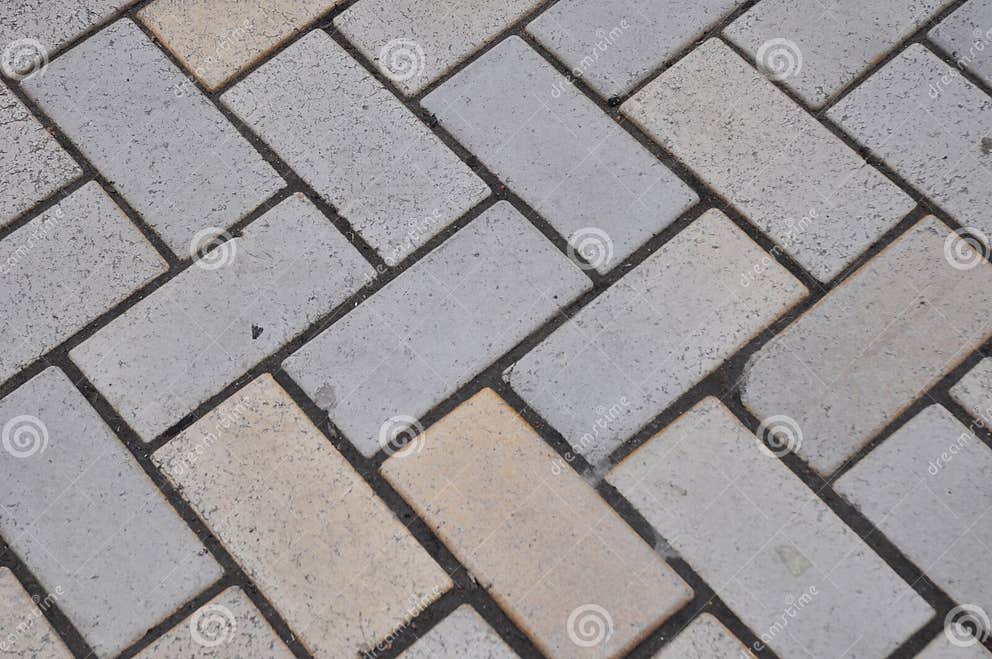 A Close Up of a Paving Herringbone Pattern Background As a Common Paver ...