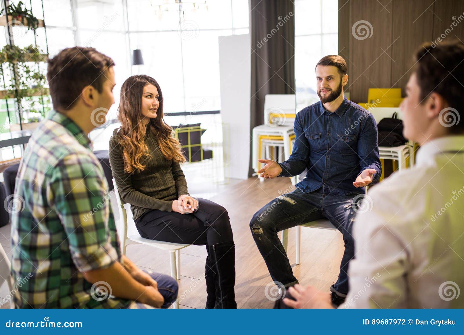 Close-up of People Communicating while Sitting in Circle and Gesturing ...