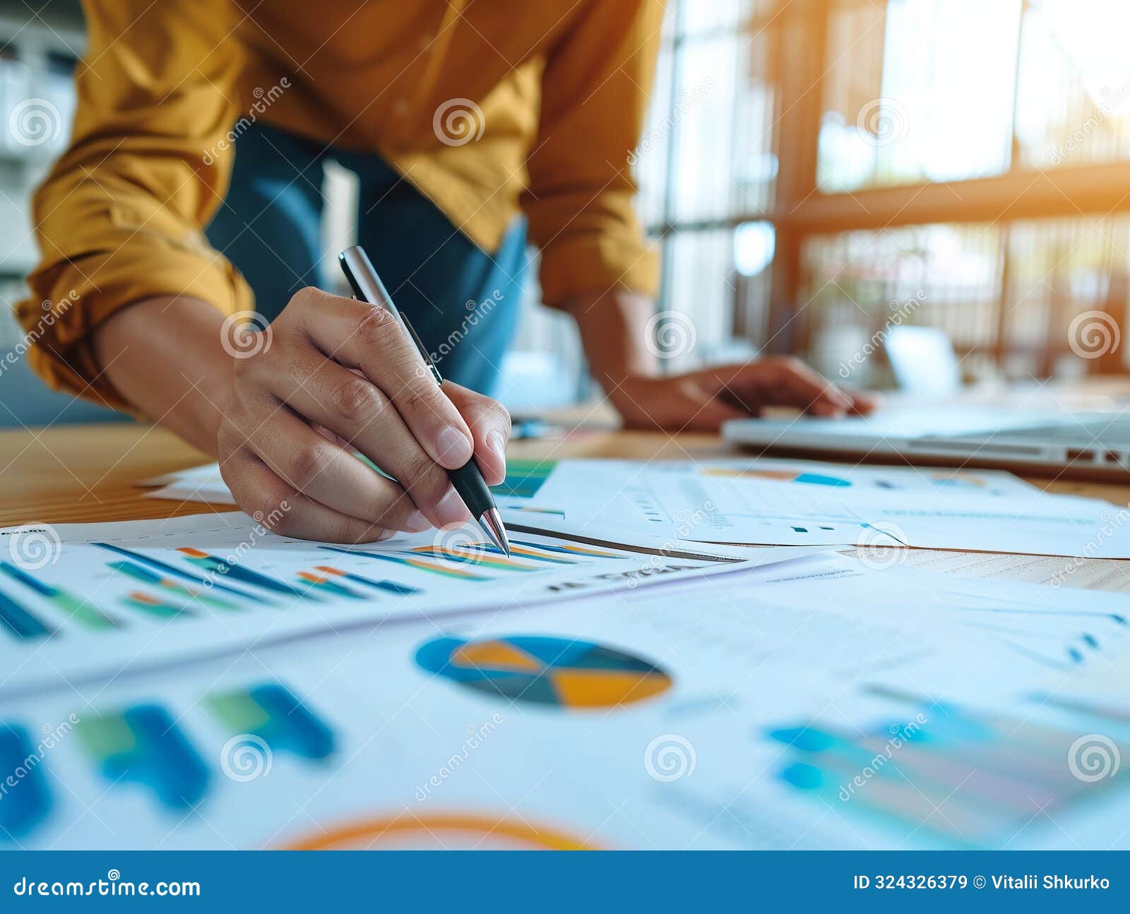 Close-up of a Person Analyzing Financial Data and Reports with Charts ...