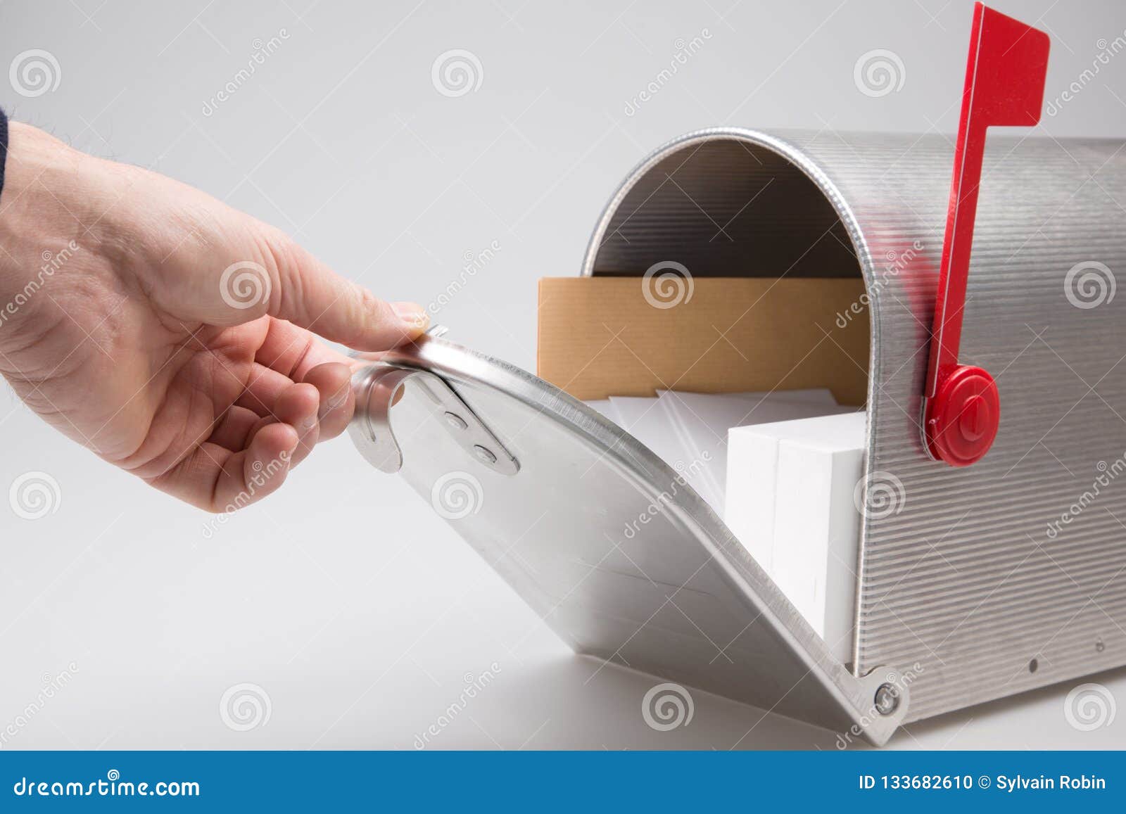 Close-up of a Person Hand Checking Mailbox in Grey Background Stock ...