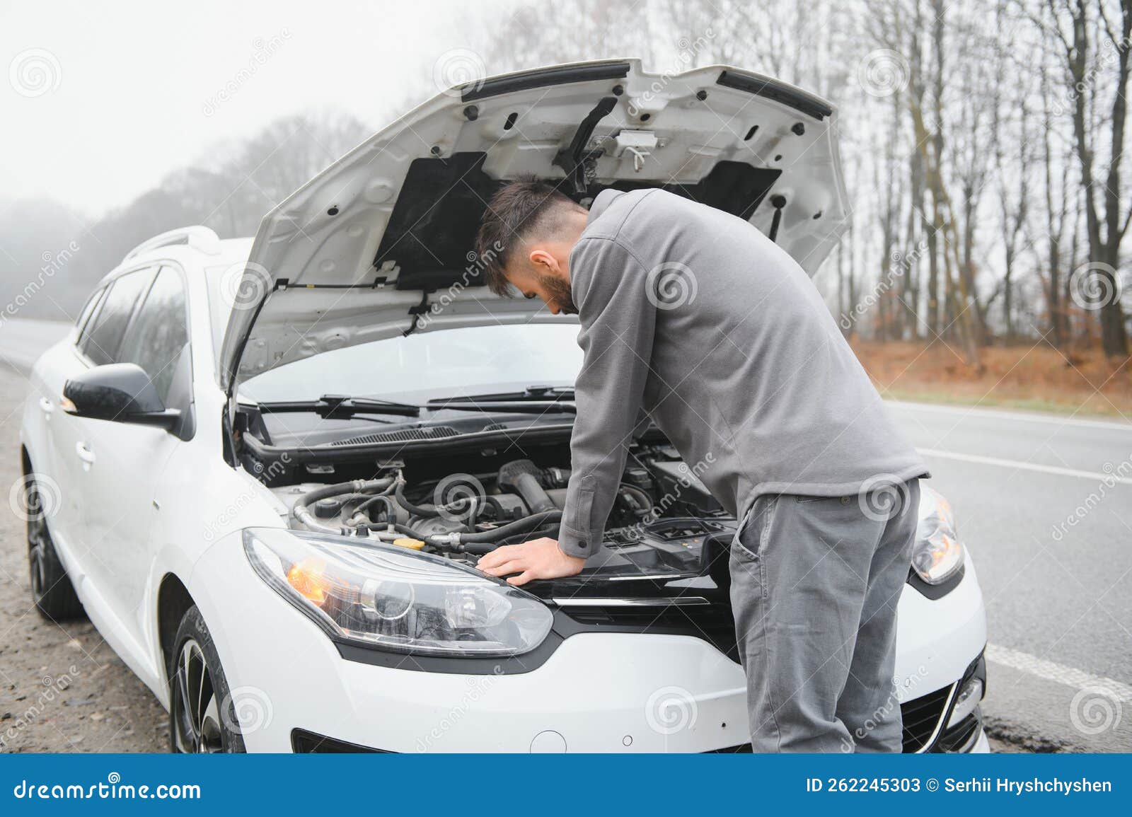 Close-up of a Person Hand Signing Contract with Keys on it Stock Image ...