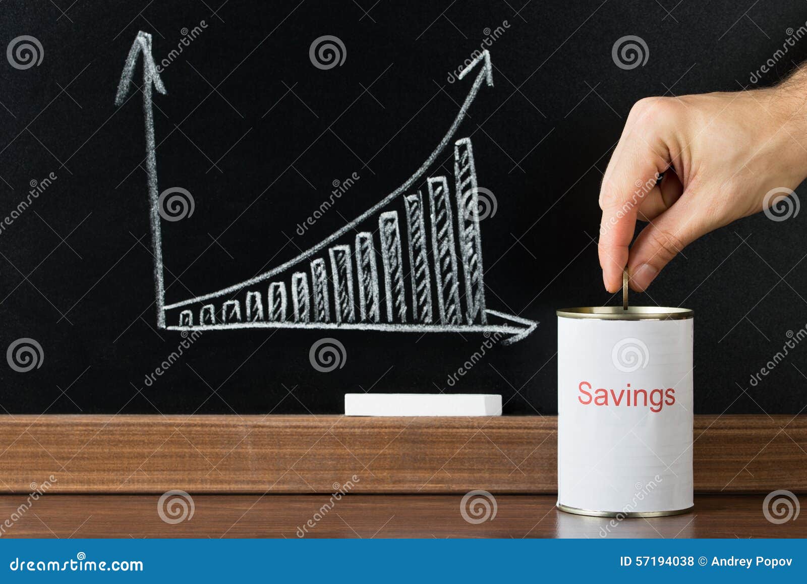 Close-up of a Person Inserting Coin in Saving Can Stock Photo - Image ...