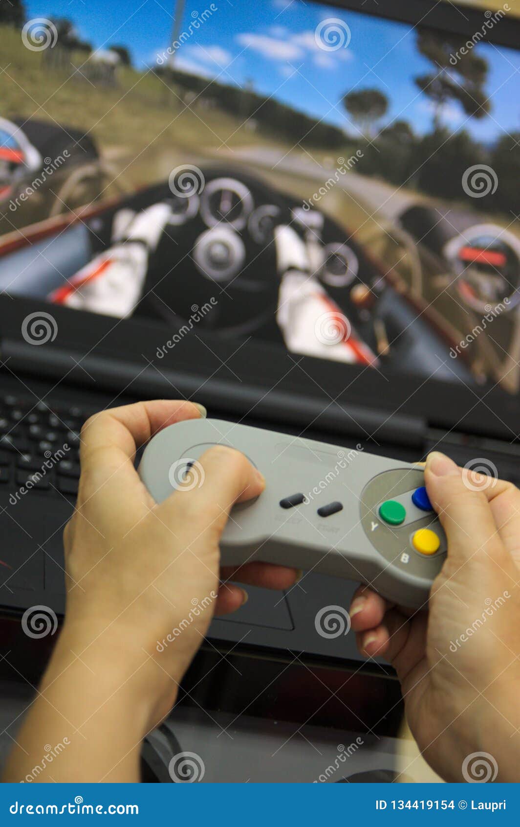 Someone Playing with a Gamepad on the Computer Stock Photo - Image of ...