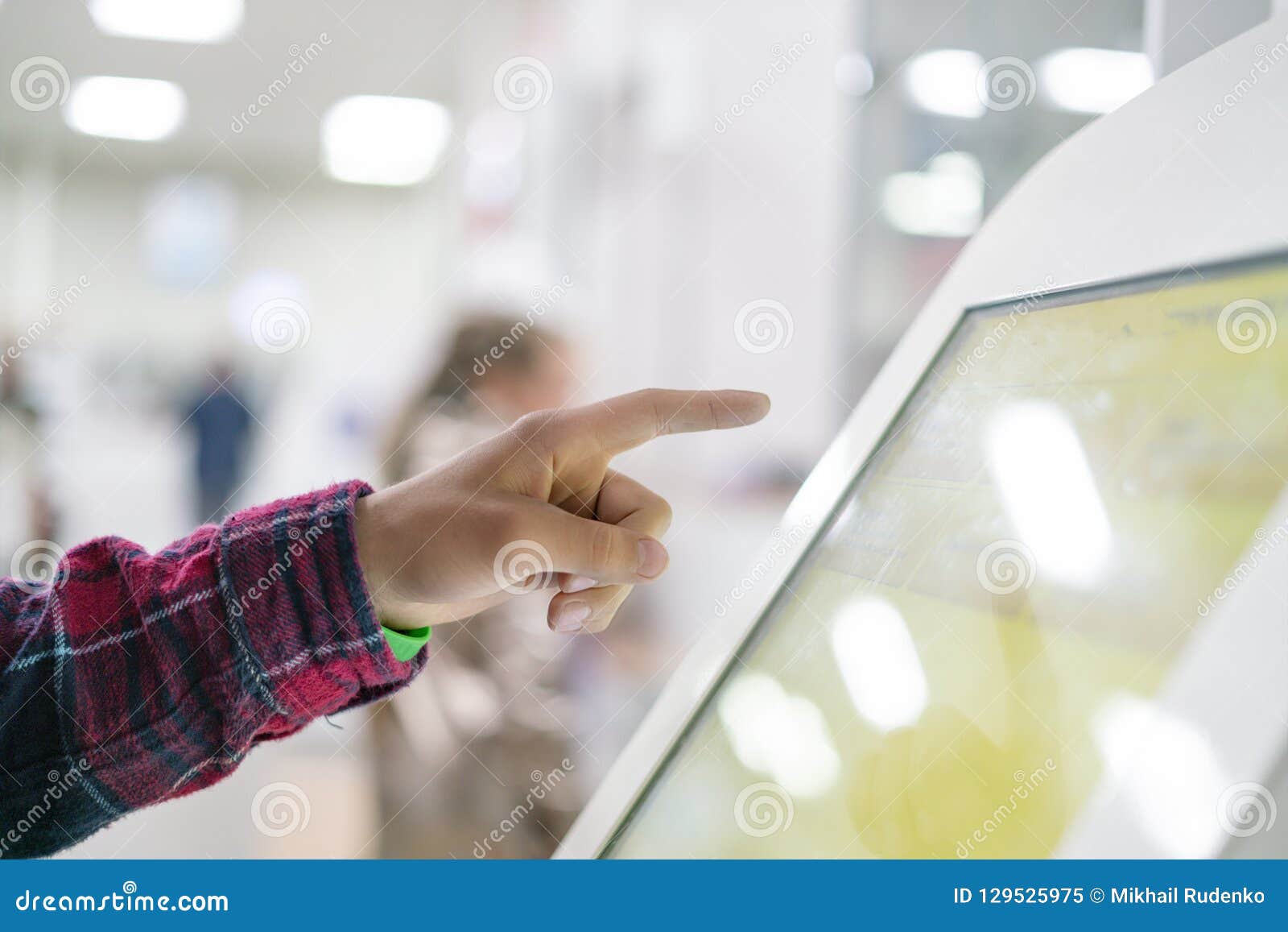 Close Up Person Using Touch Screen Panel in Post Office To Recieve a ...