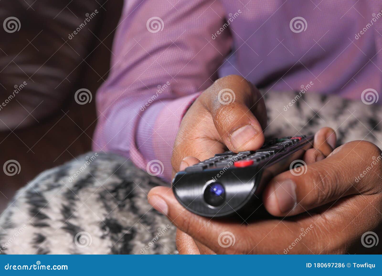 Close Up of a Person Using Tv Remote Stock Photo - Image of container ...
