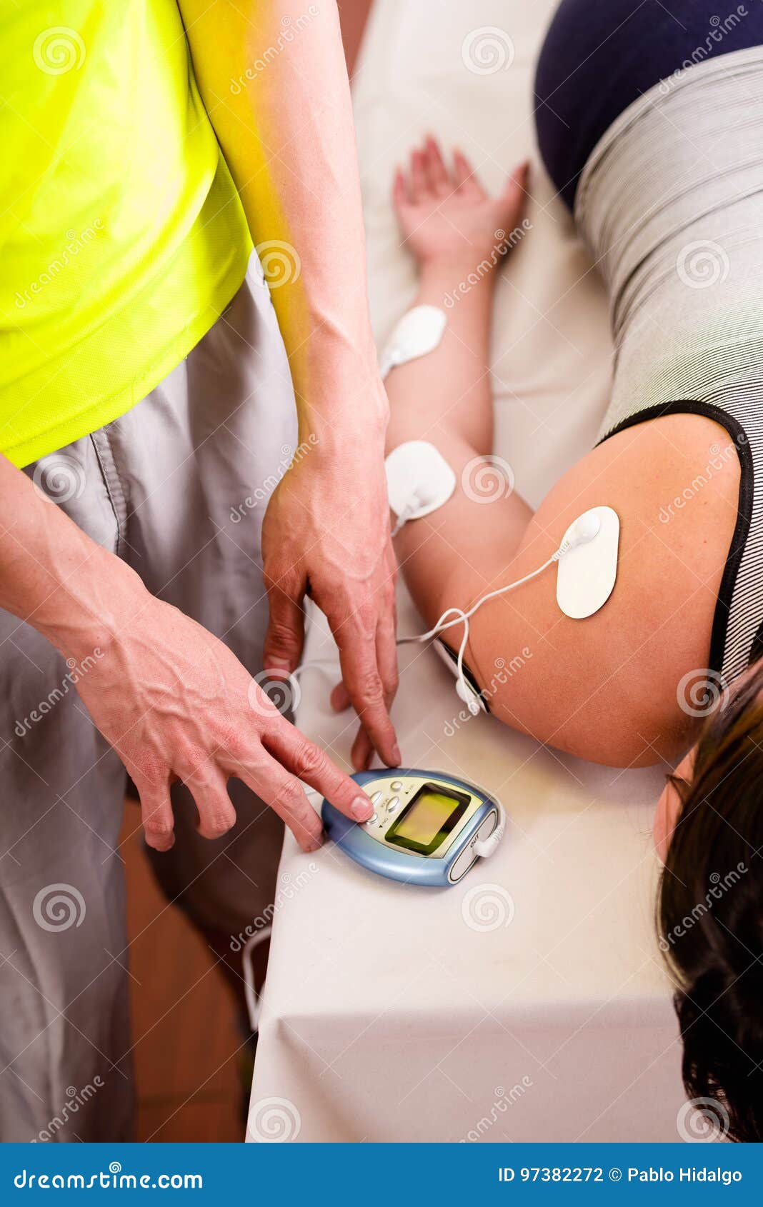 Close-up of a Personal Trainer Touching with One Hand the Electric ...