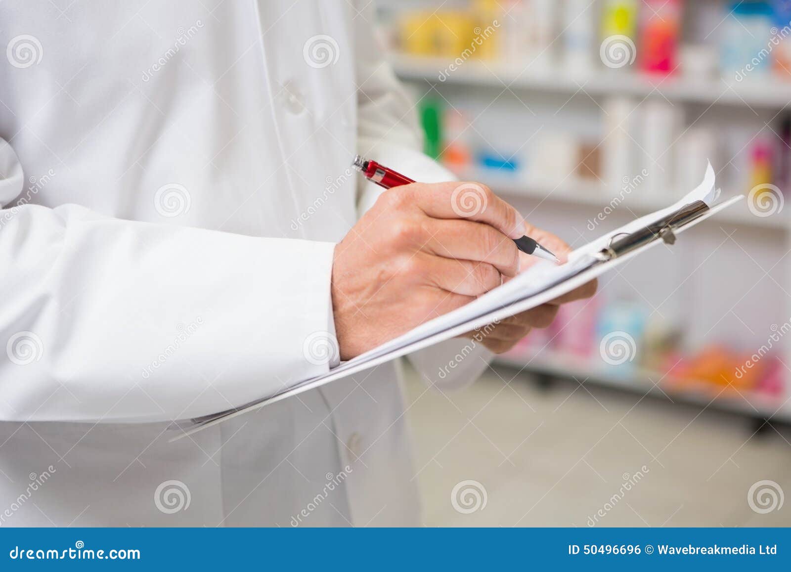 Close Up of Pharmacist Writing on Clipboard Stock Photo - Image of ...