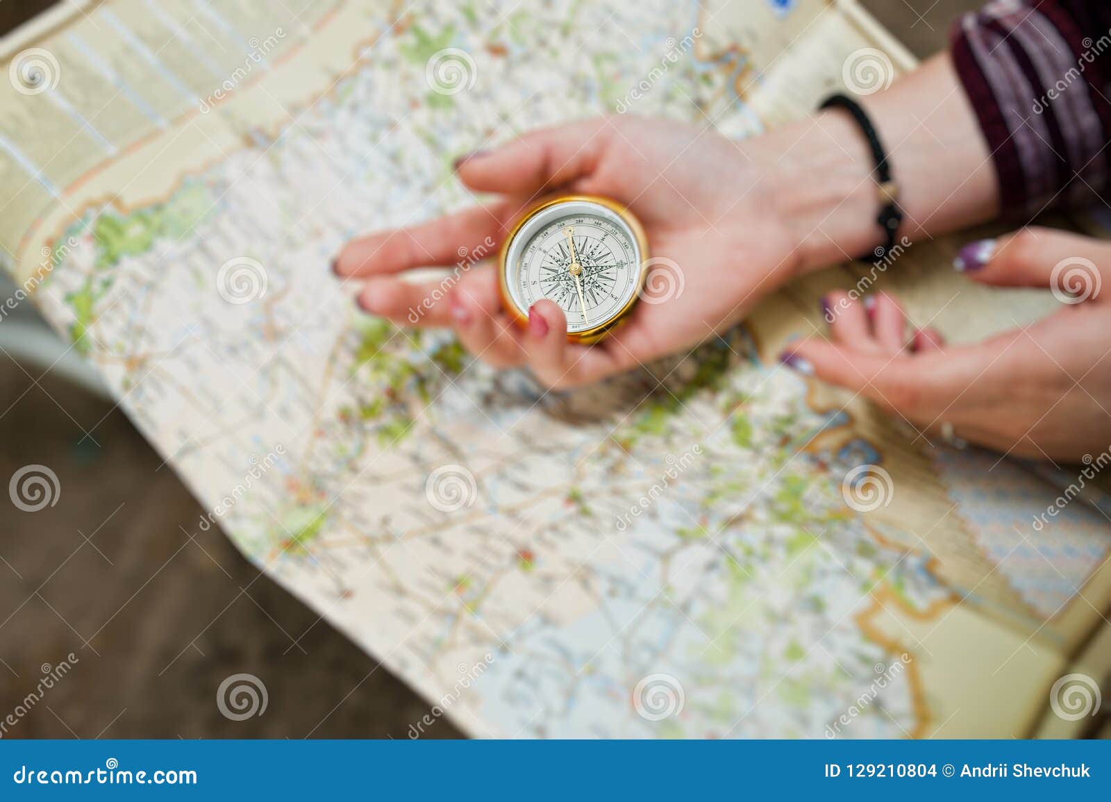 Close-up Photo of Female Hands with Compass on a Map. Stock Photo ...