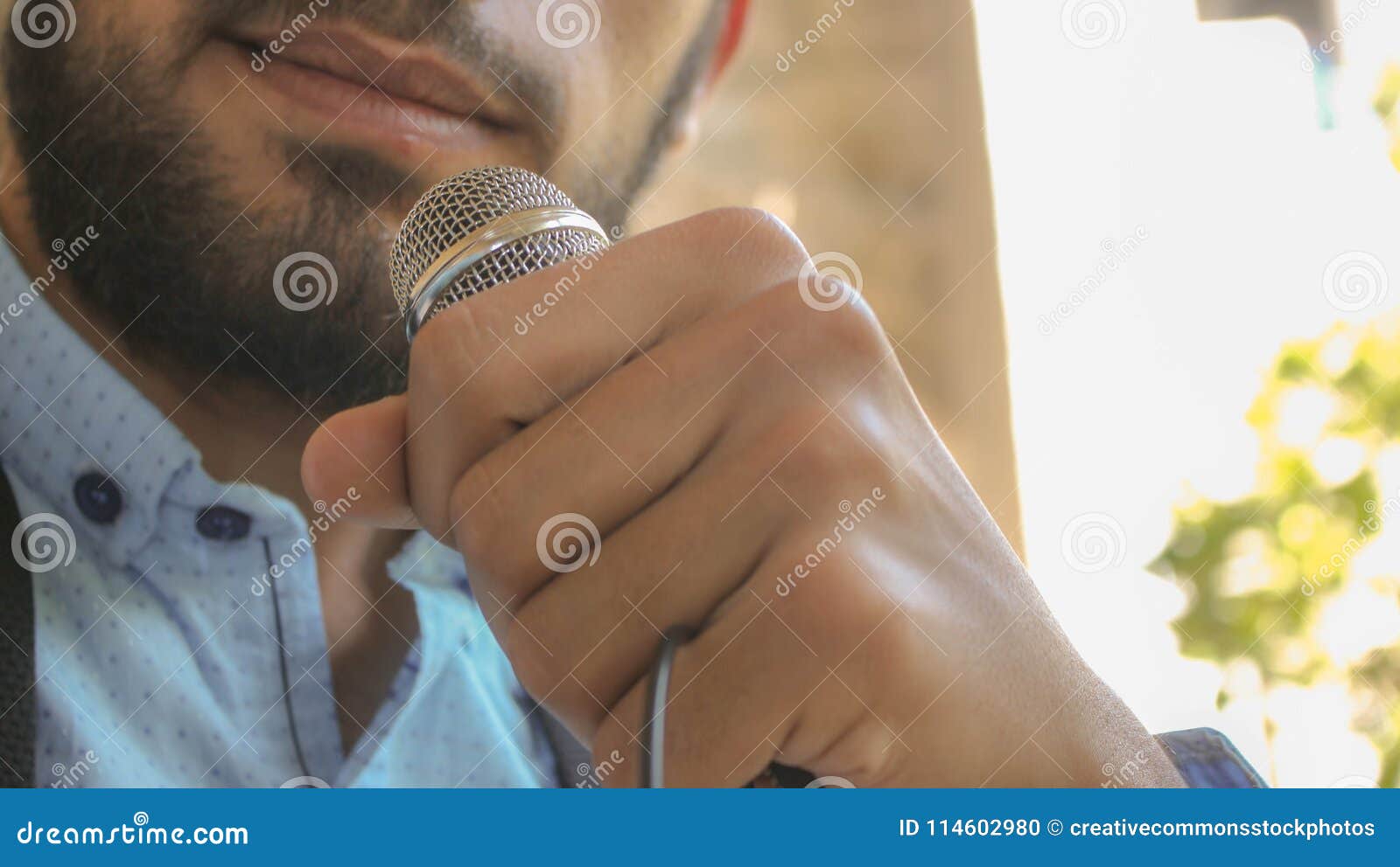 Close-up Photo Of Man Holding Microphone Picture. Image: 114602980