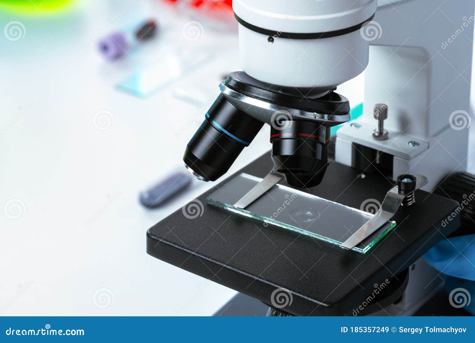 Close Up Photo of a Microscope Lenses Examining Glass Sample Stock ...