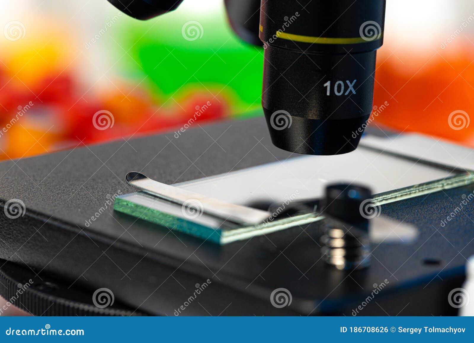 Close Up Photo of a Microscope Lenses Examining Glass Sample Stock ...