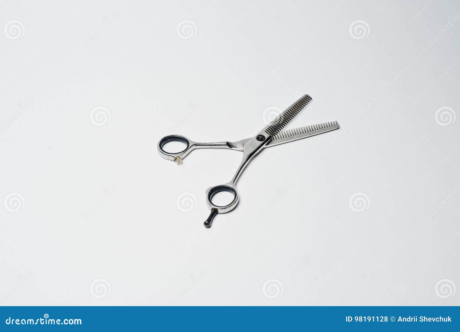 Close-up Photo of a Pair of Silver Scissors Laying on the White Stock ...