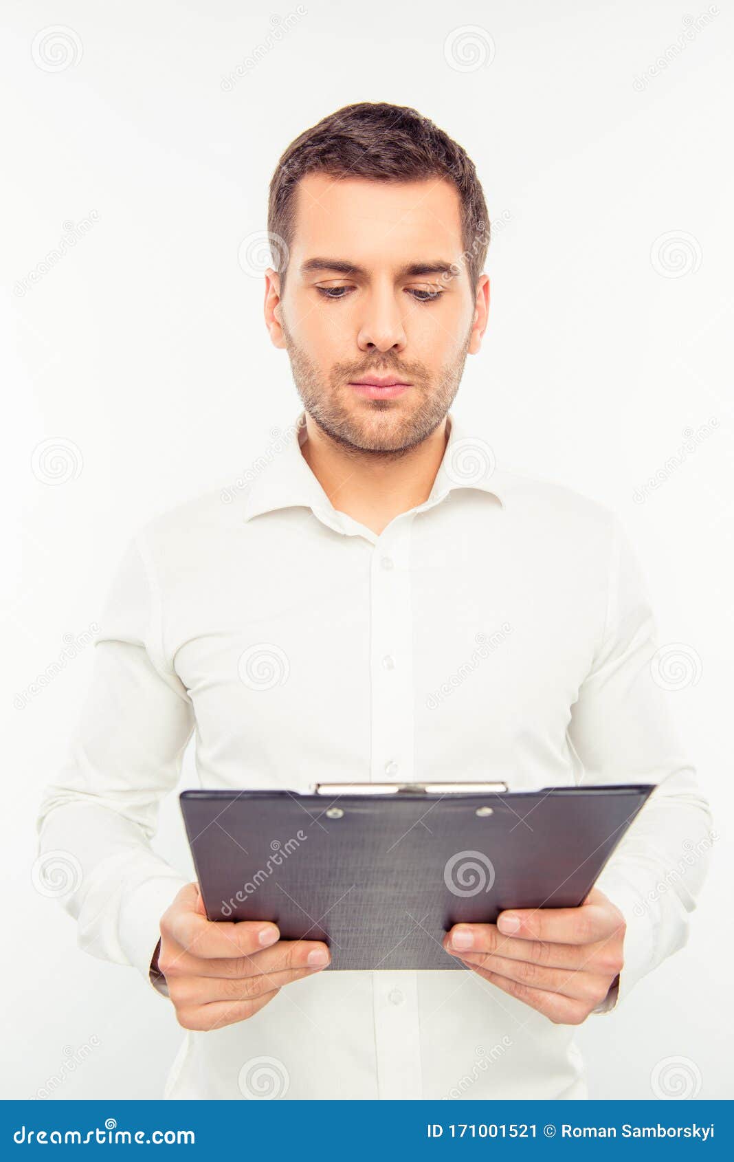 Close Up Photo of Serious Young Man Holding a Folder Stock Image ...
