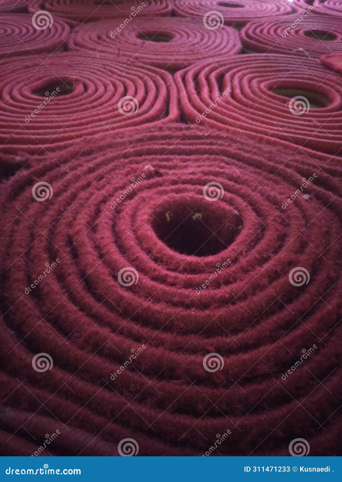 Close Up Photo of Several Rolls of Red Mosque Carpet Stock Image ...