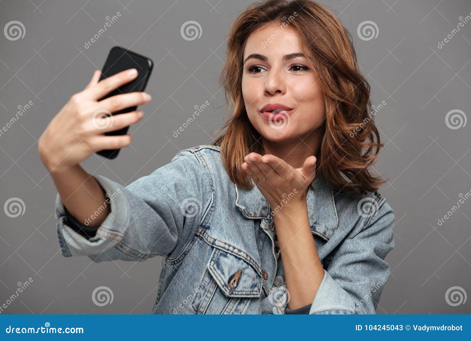 Close Up Photo Of Young Attractive Woman Sending Air Kiss While Stock