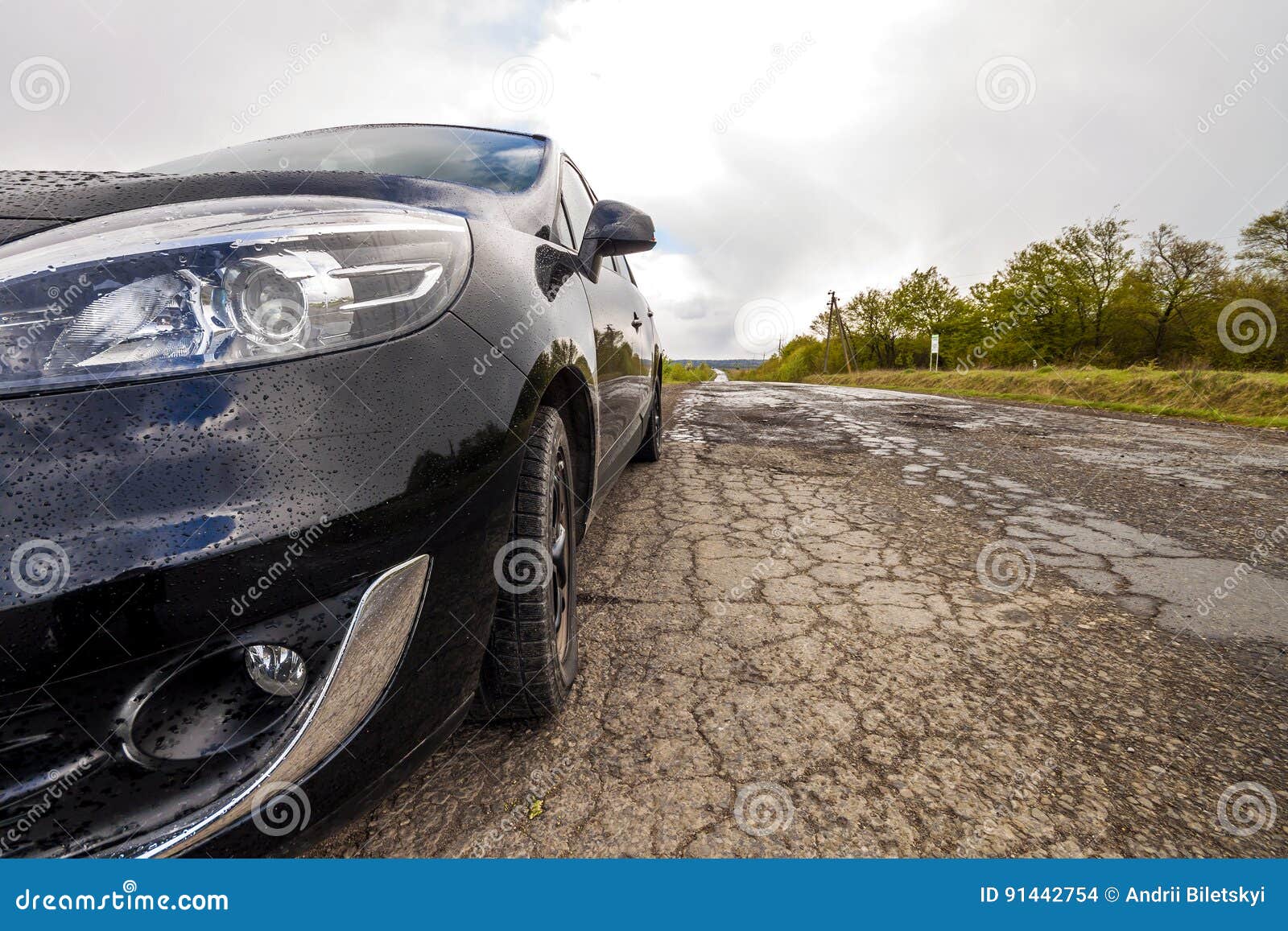 Close-up Picture of a Modern Car on a Bad Road Stock Photo - Image of ...