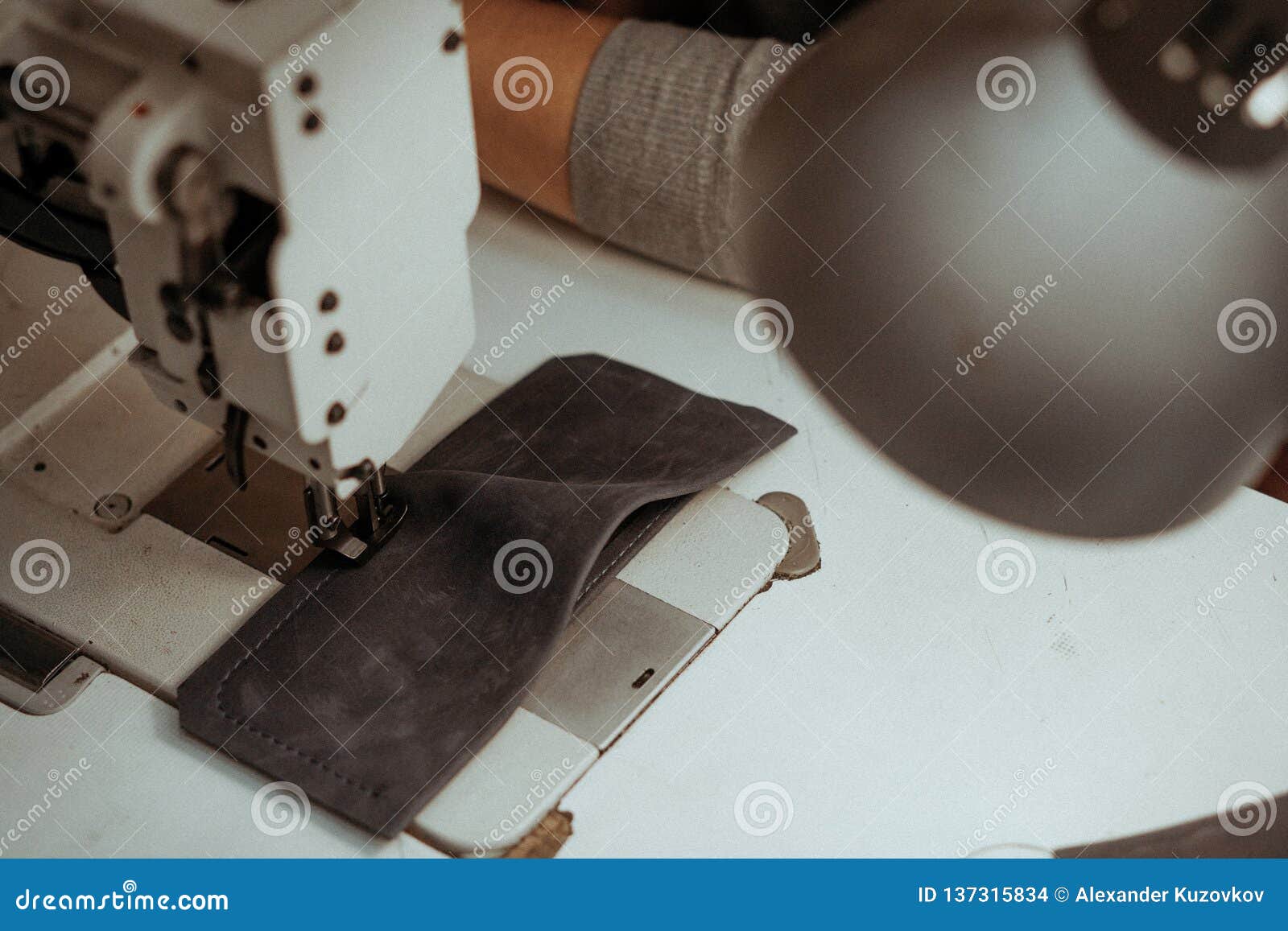 Close-up of a Piece of Leather Lying on a Sewing Machine on the Table ...